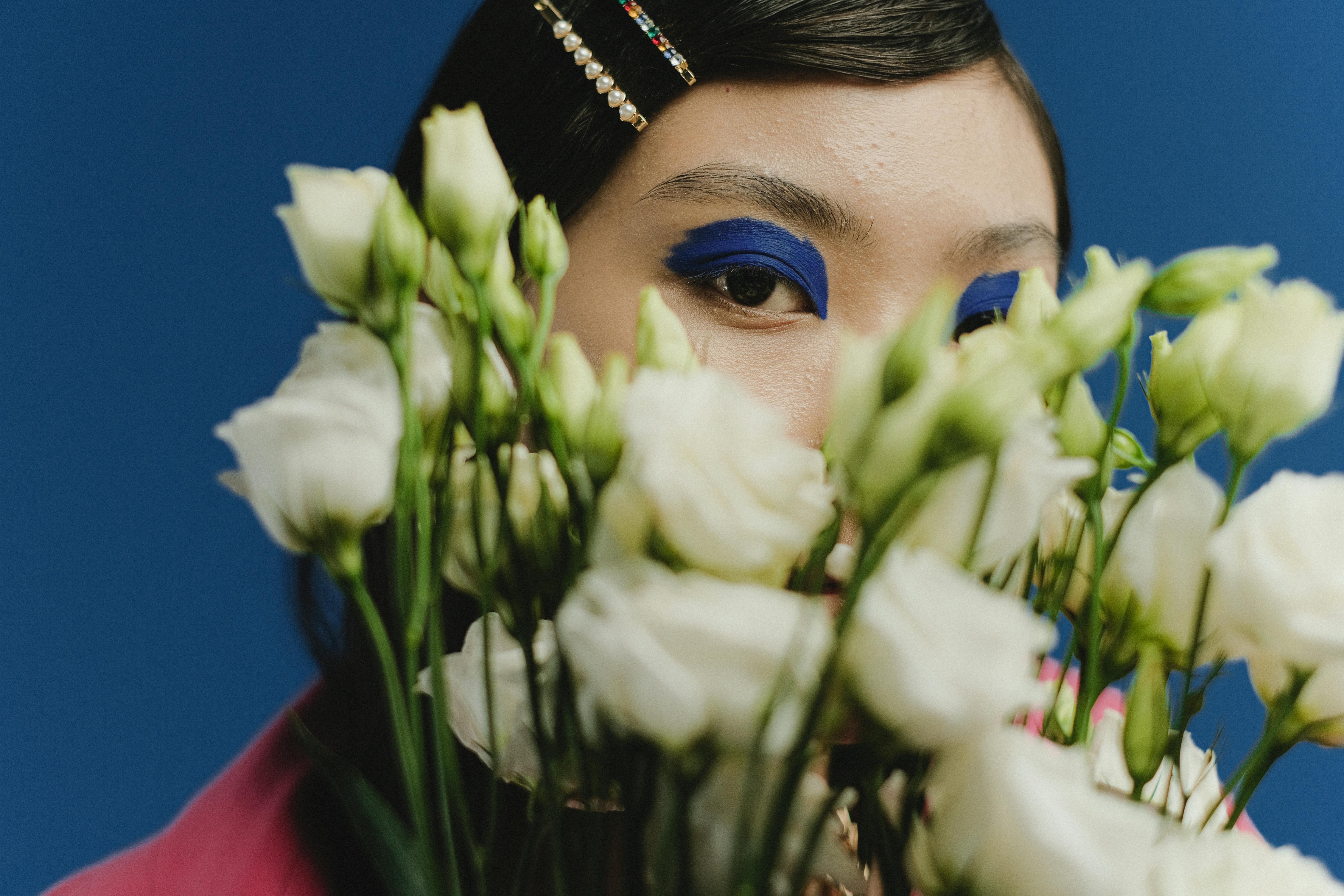 Flowers Covering a Woman's Face · Free Stock Photo