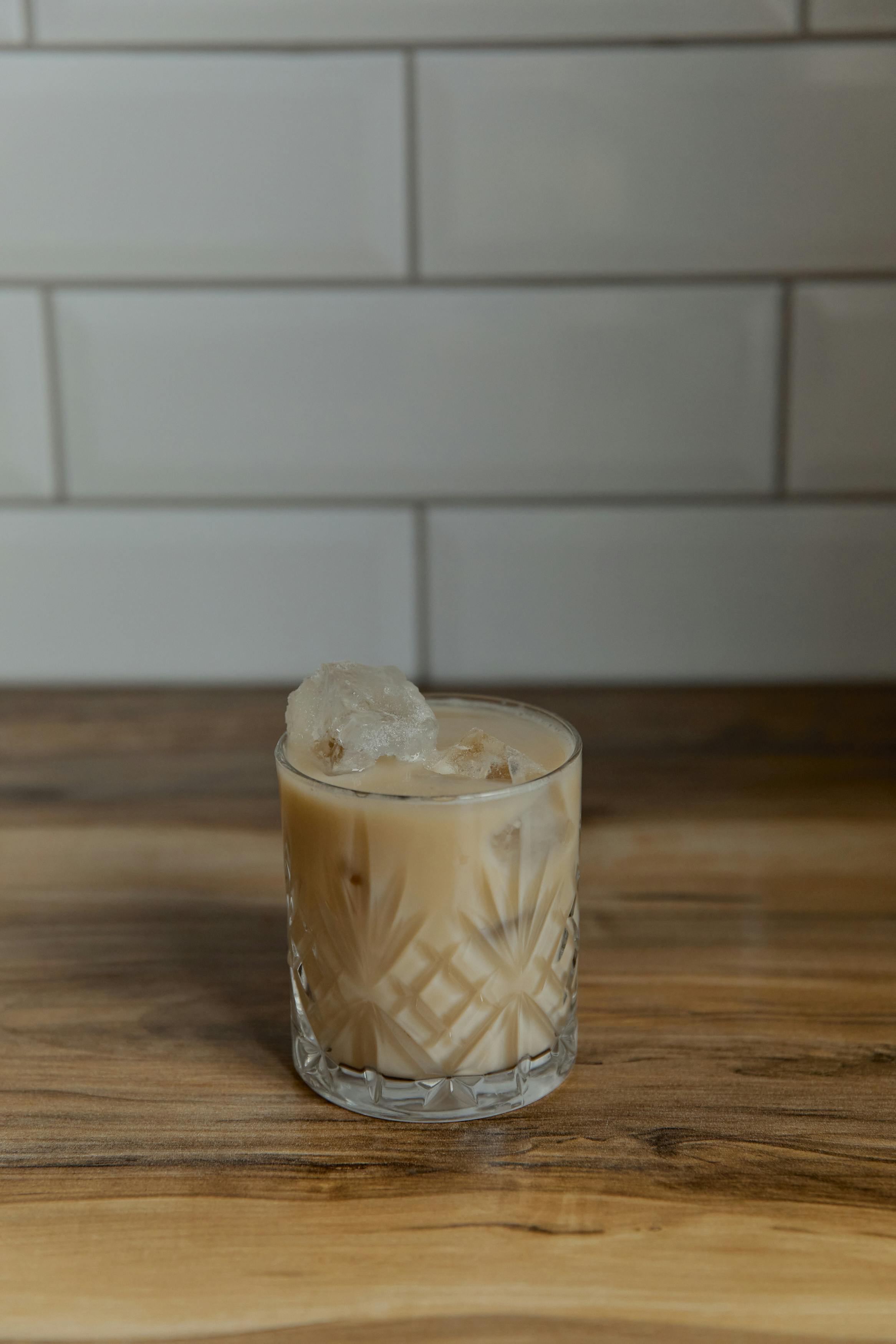A Glass of Ice Coffee on a Wooden Table · Free Stock Photo