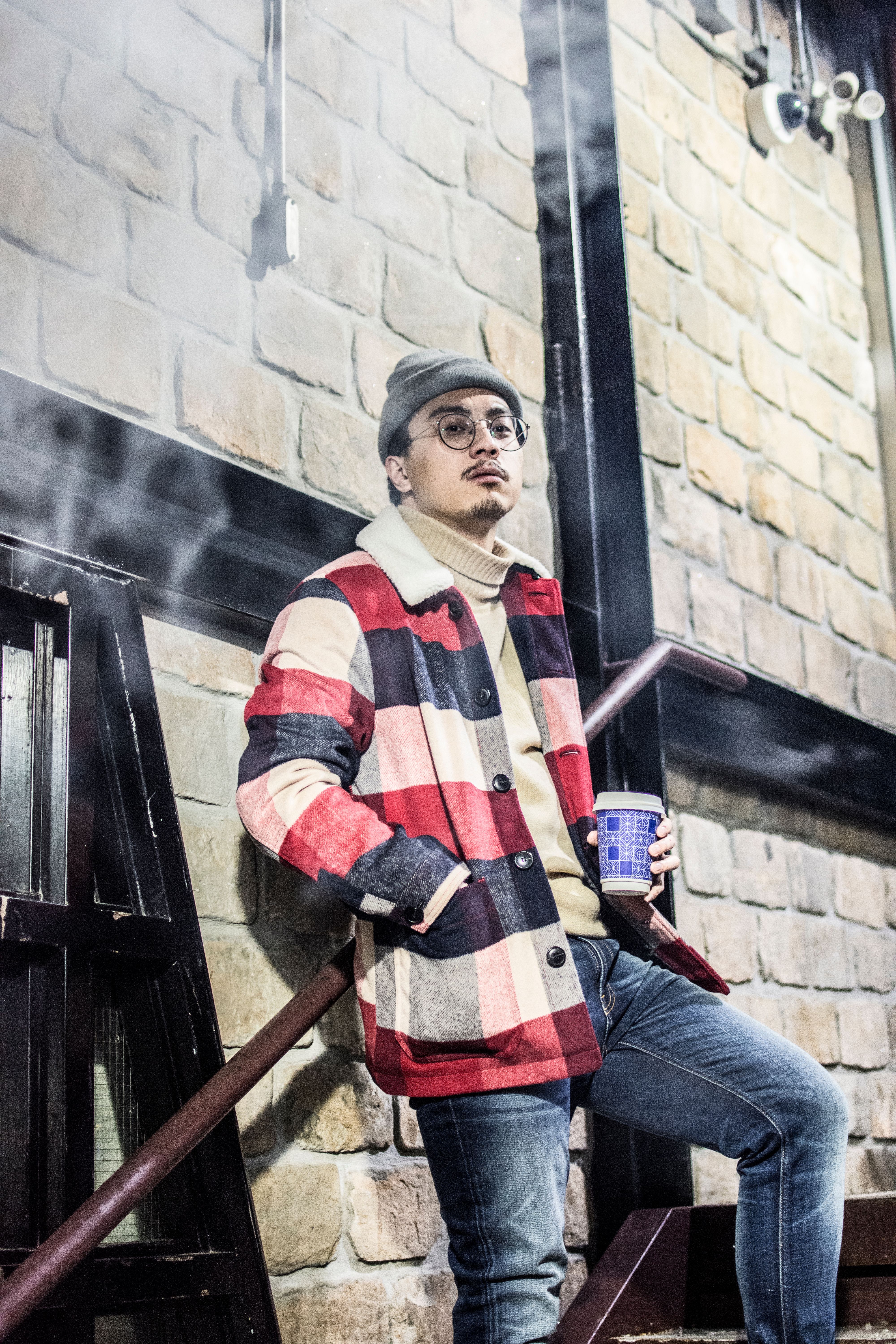 Man in Red, Black, and Grey Plaid Button-up Jacket With Blue Denim ...