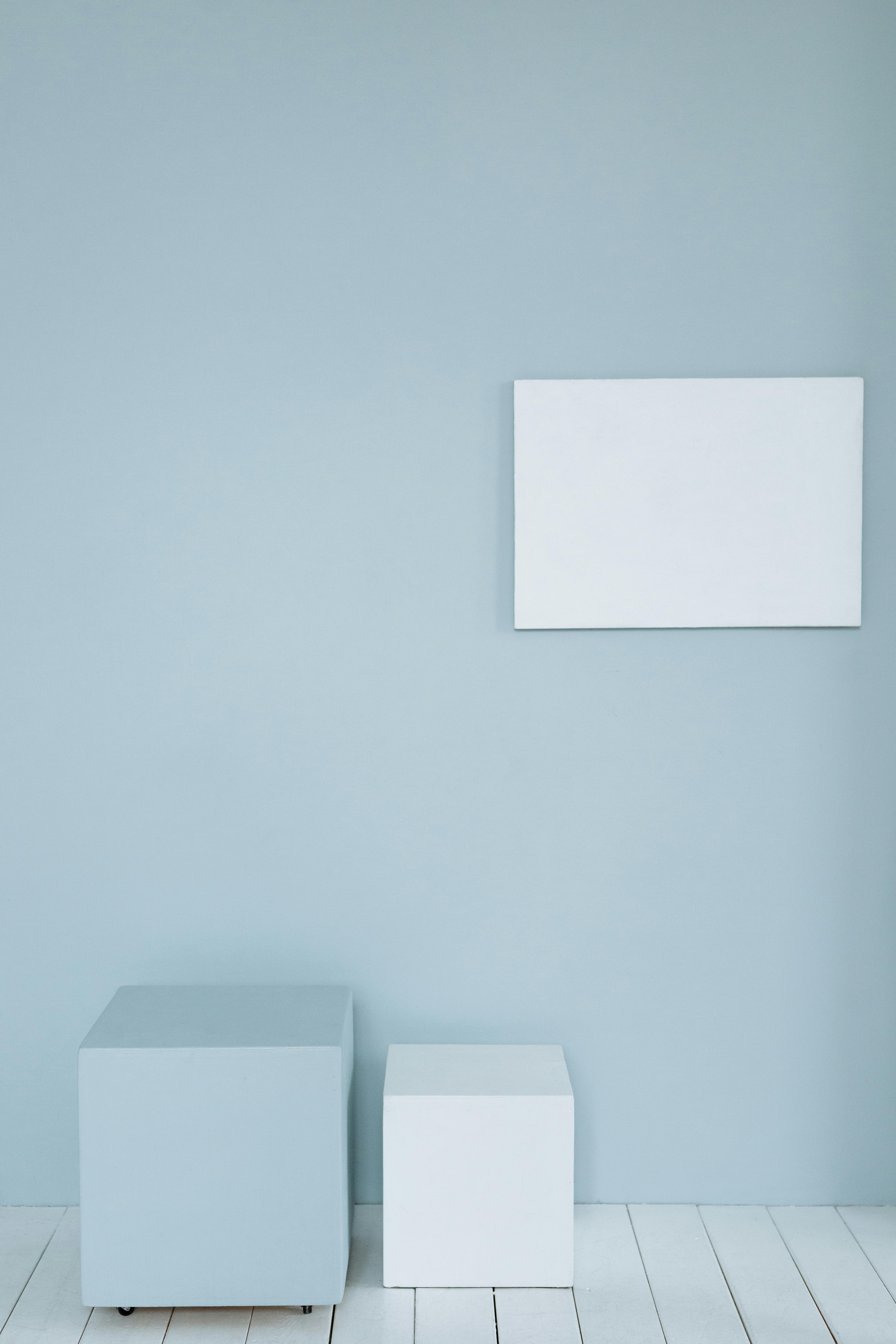 Rectangular empty photo frame against tiled wall · Free Stock Photo