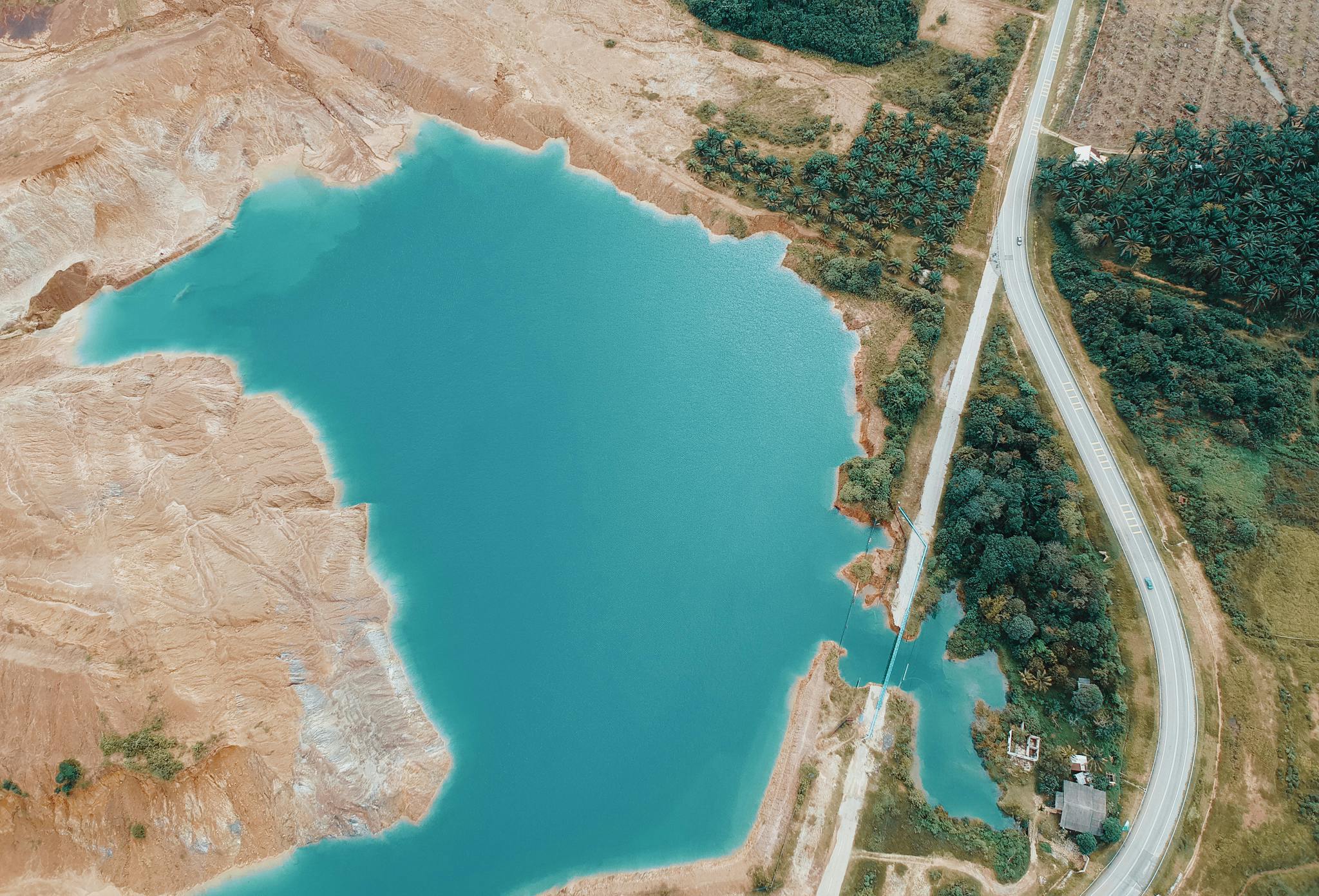 Aerial Photo of Lake Near Highway · Free Stock Photo