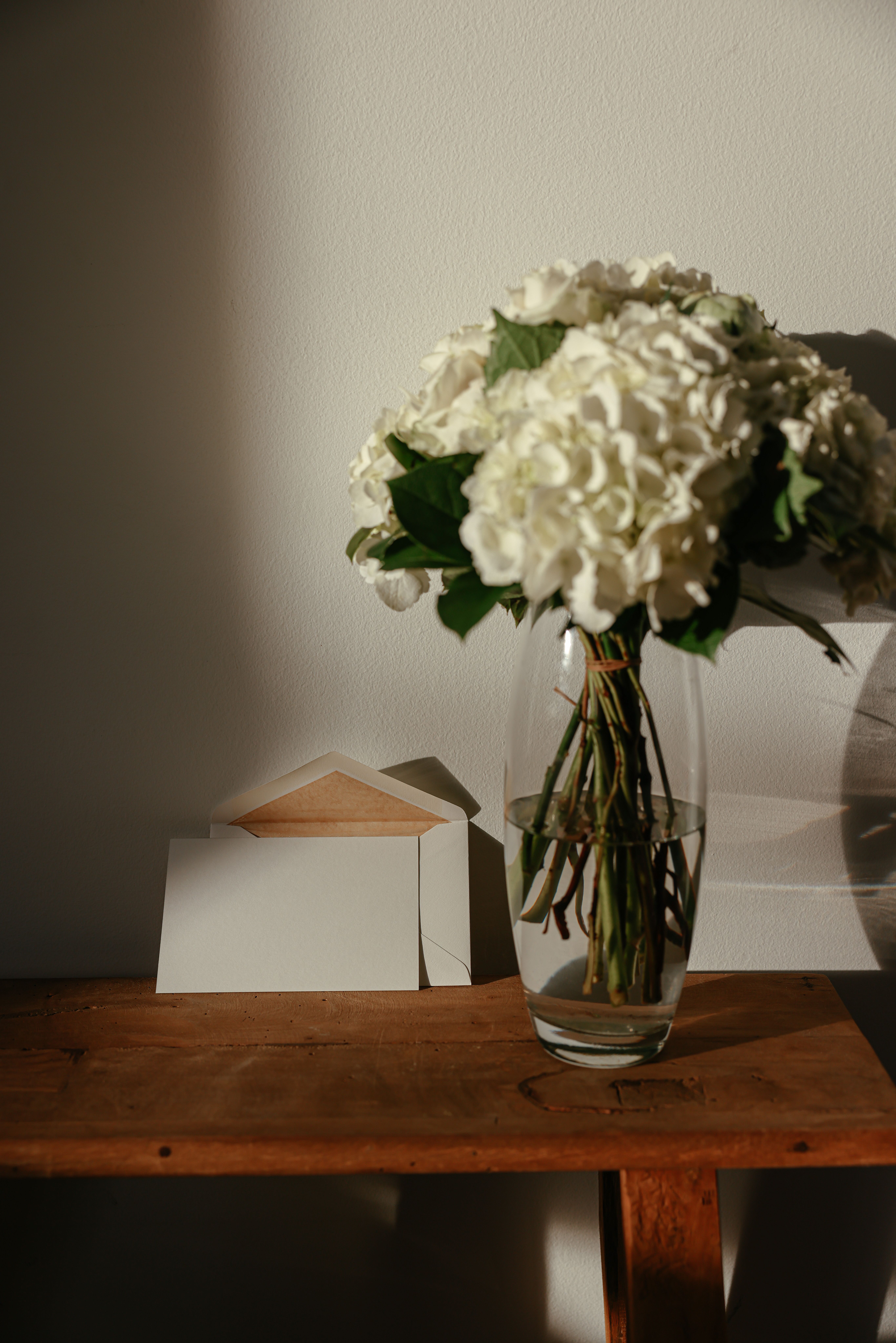 Flowers in a Glass Vase on top of a Table · Free Stock Photo
