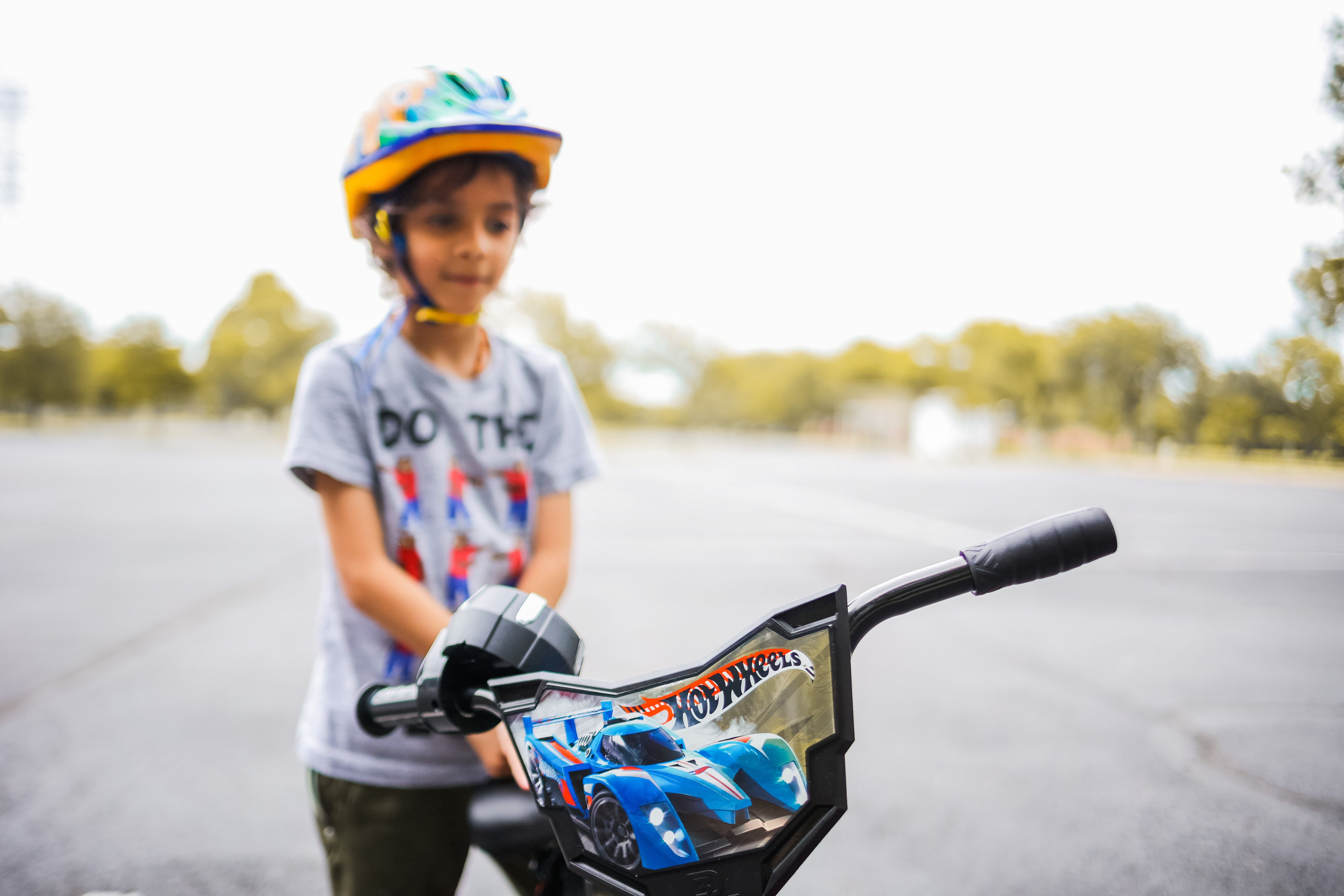 A Child Standing with a Bicycle · Free Stock Photo