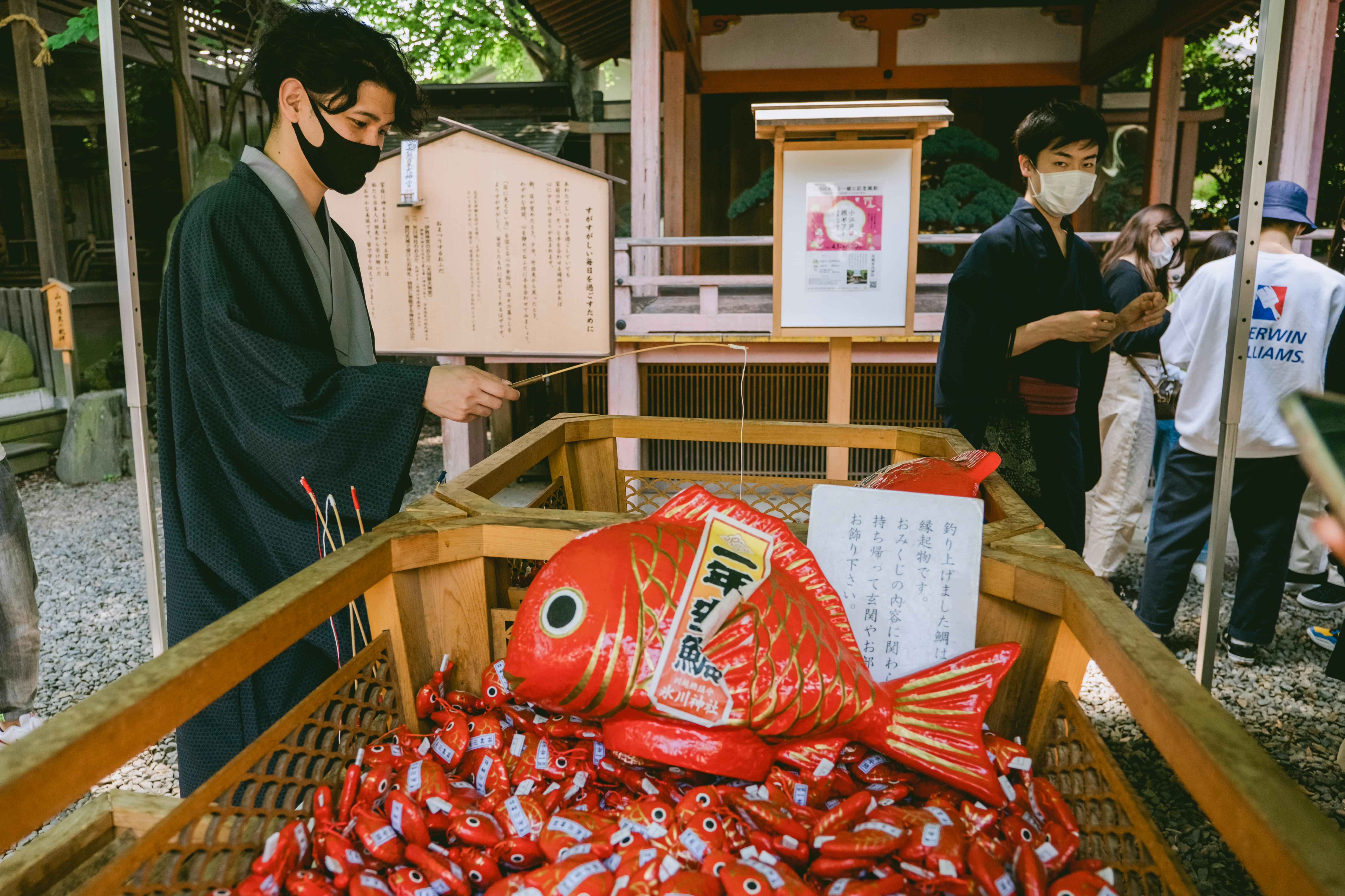 Man in Black Kimono and Black Face Mask Standing Beside Wooden Tank ...