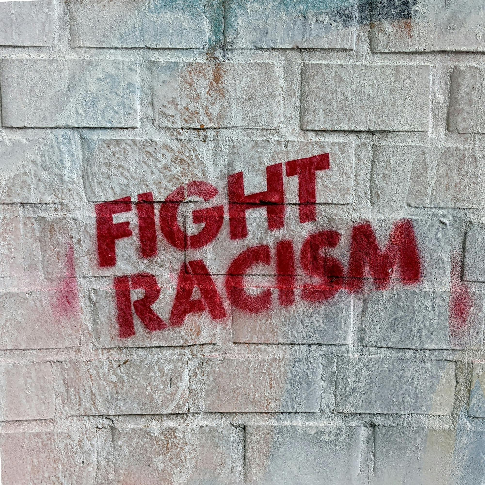 Fight Racism Sign Spraypainted on a Wall · Free Stock Photo