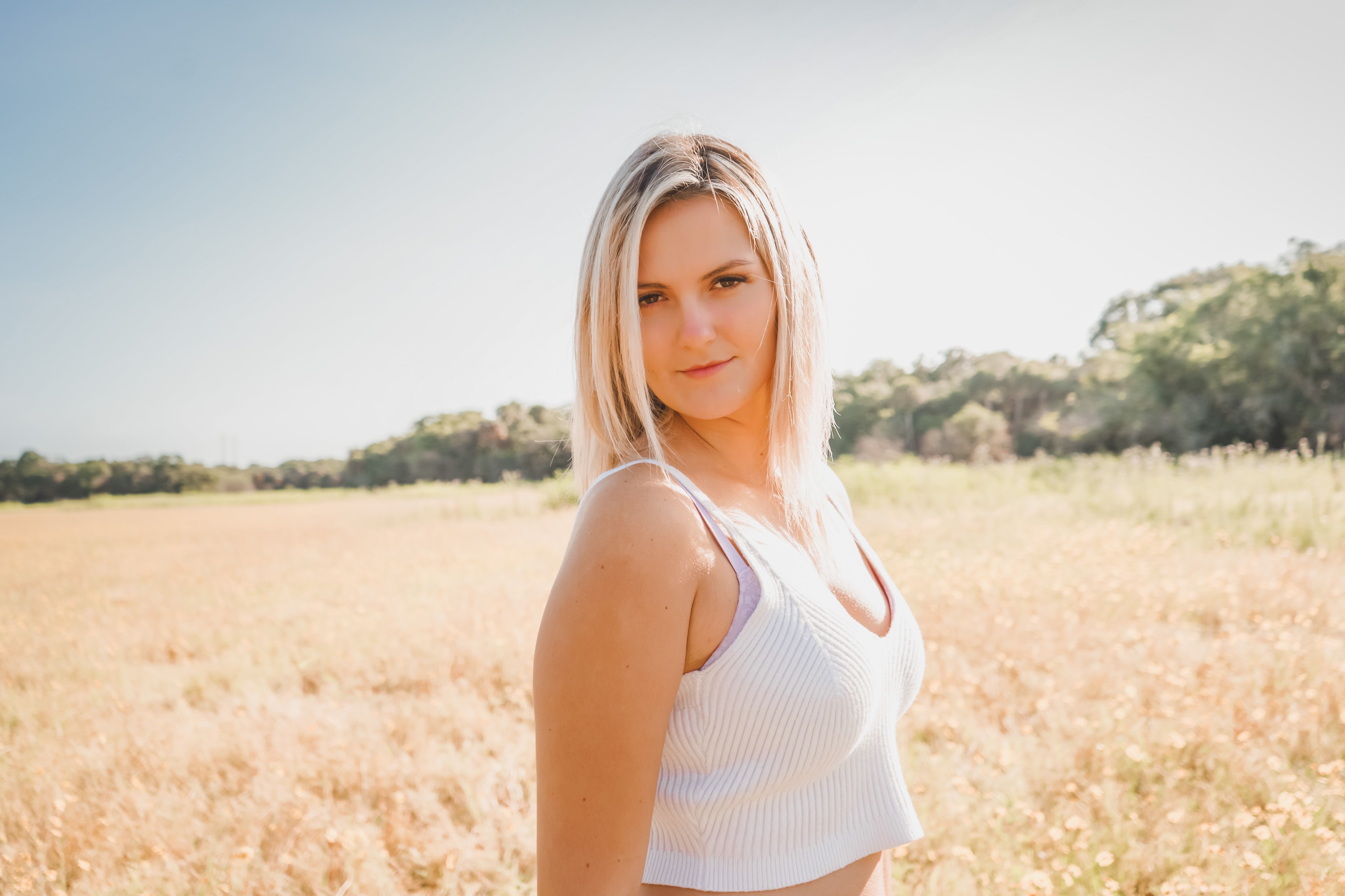 Girl in White Tank Top on the Beach · Free Stock Photo
