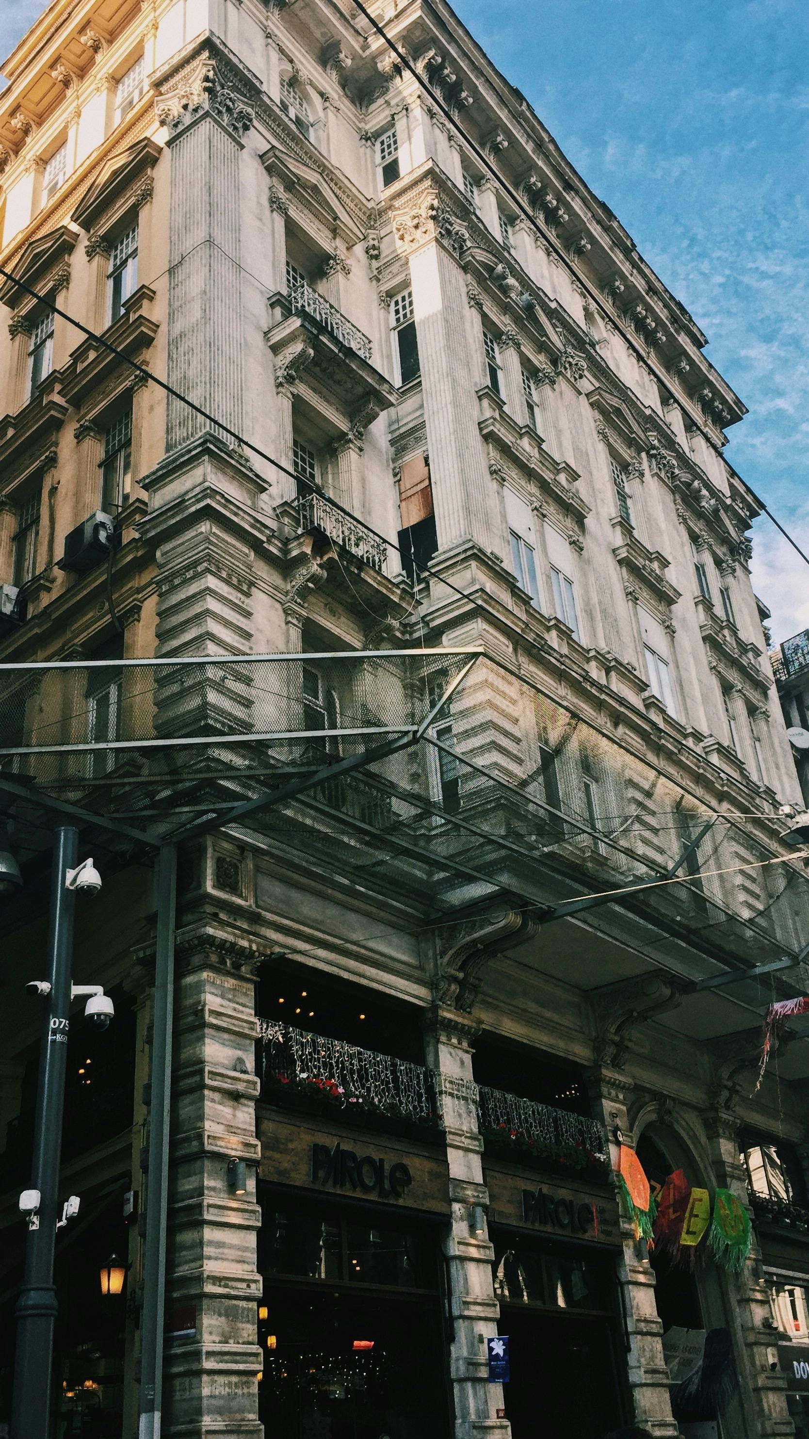 A Tall Building with a Storefront · Free Stock Photo