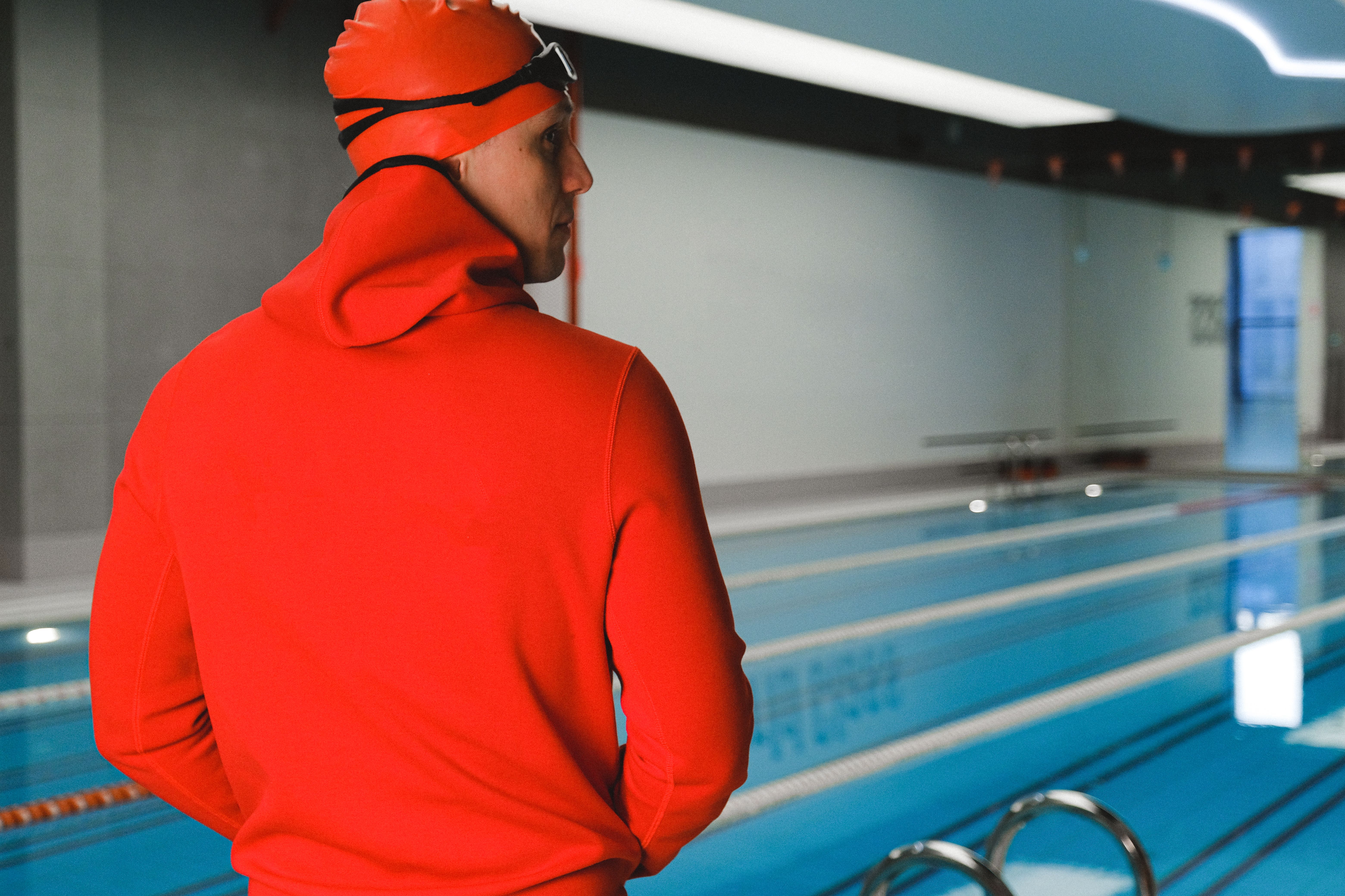 A Swimmer Standing by the Poolside · Free Stock Photo