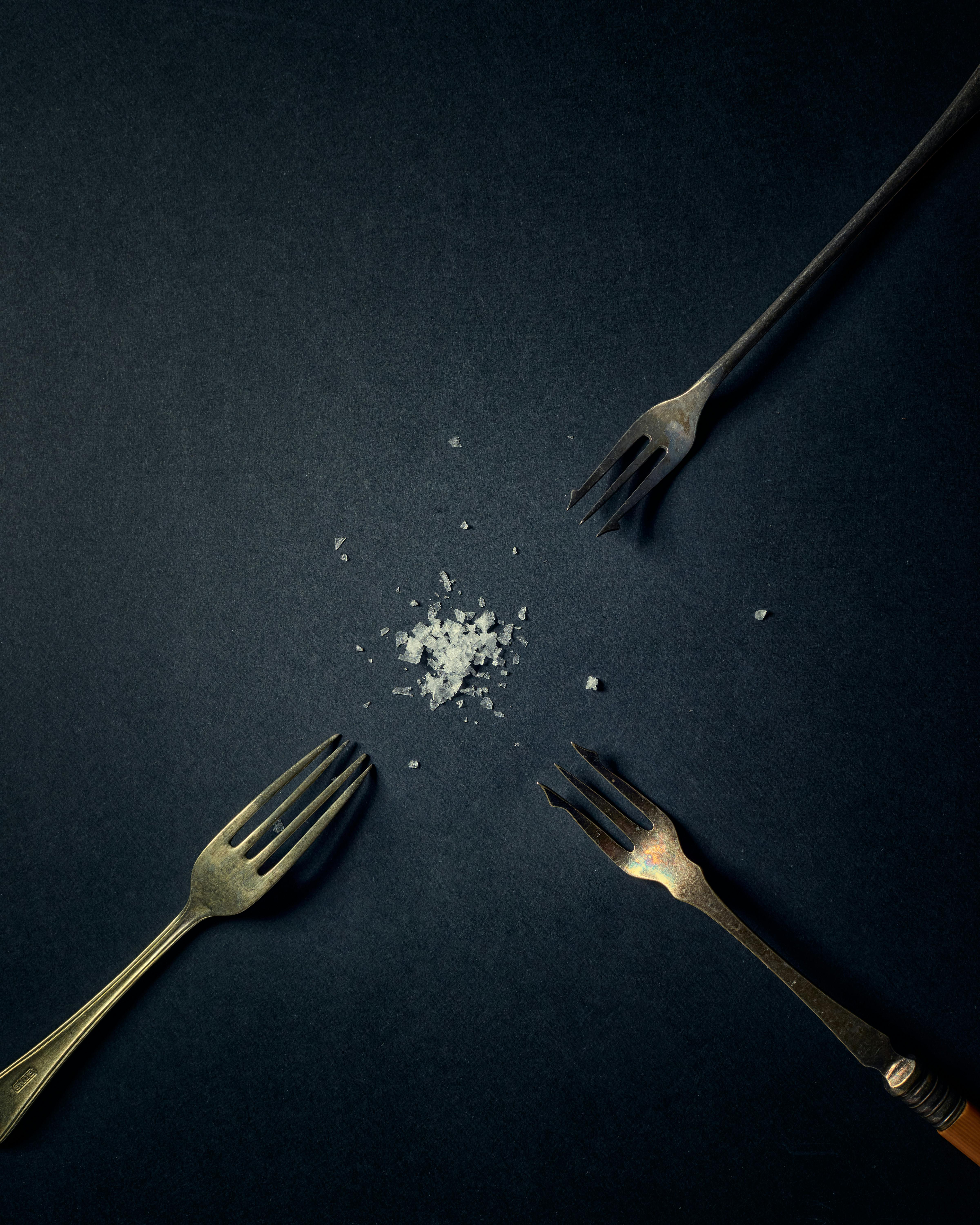 Photo of Silver Forks Near Rock Salts · Free Stock Photo