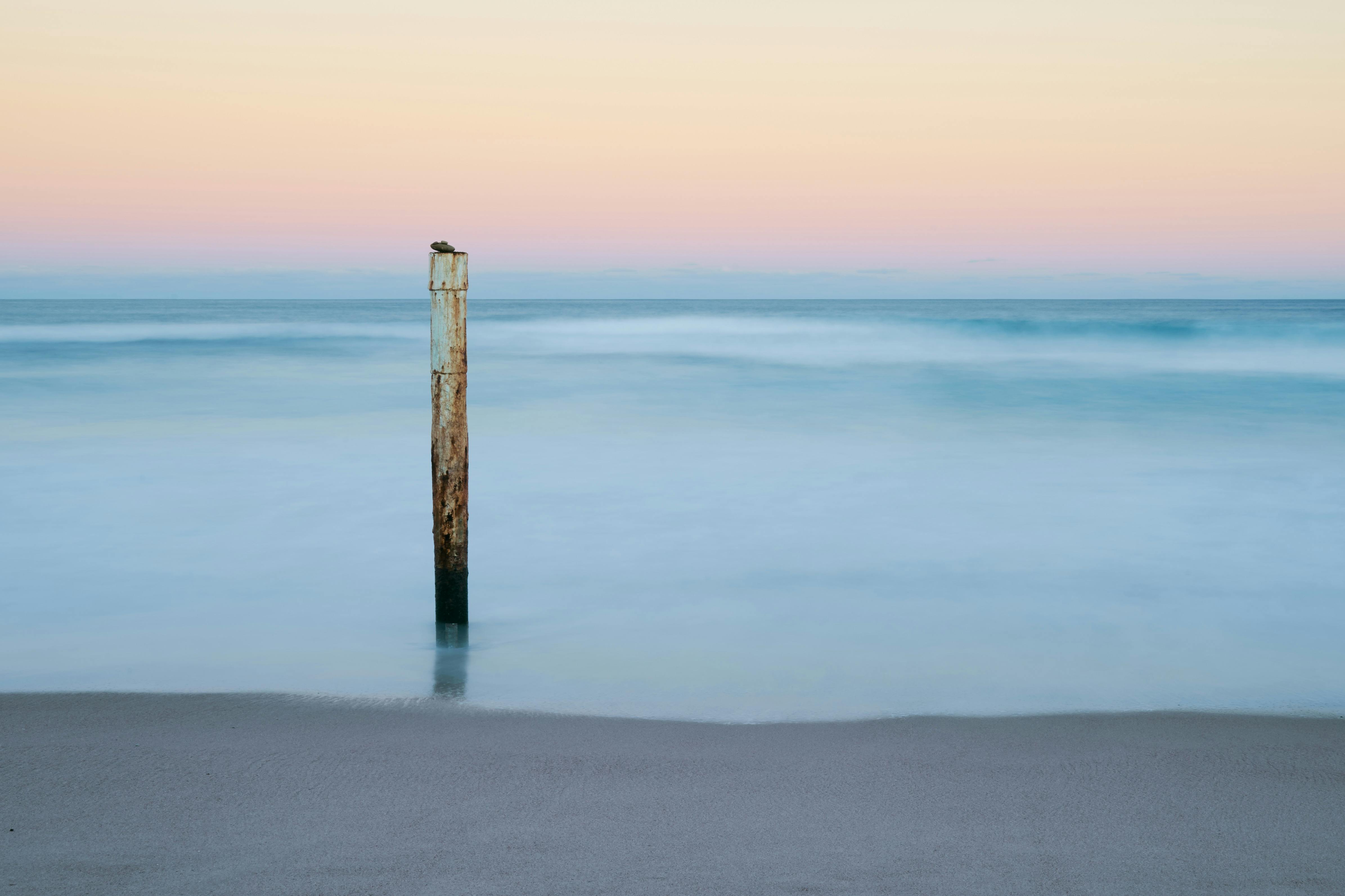 Rusty Pole on the Beach · Free Stock Photo