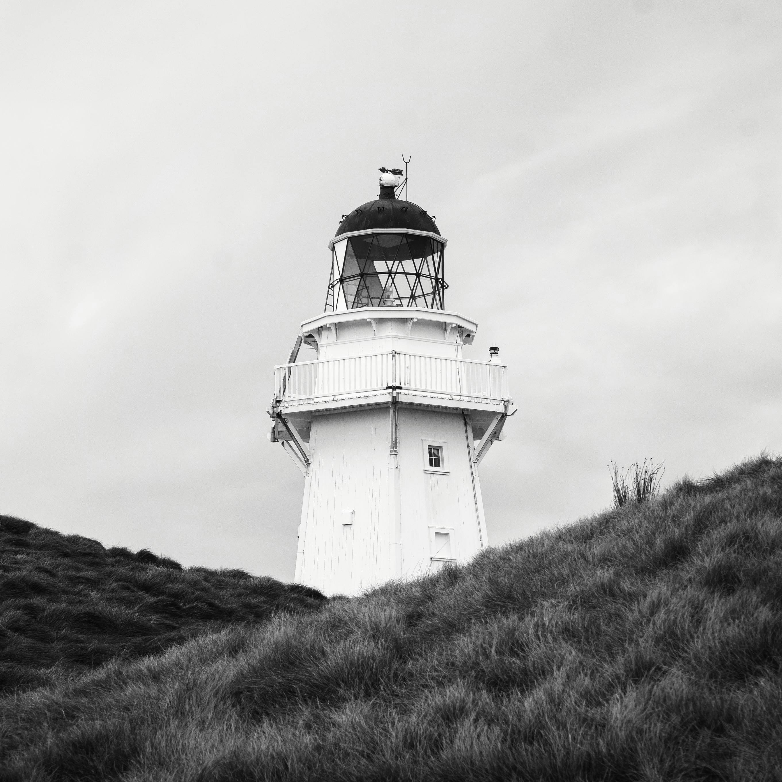 Grayscale Photo of a Lighthouse · Free Stock Photo