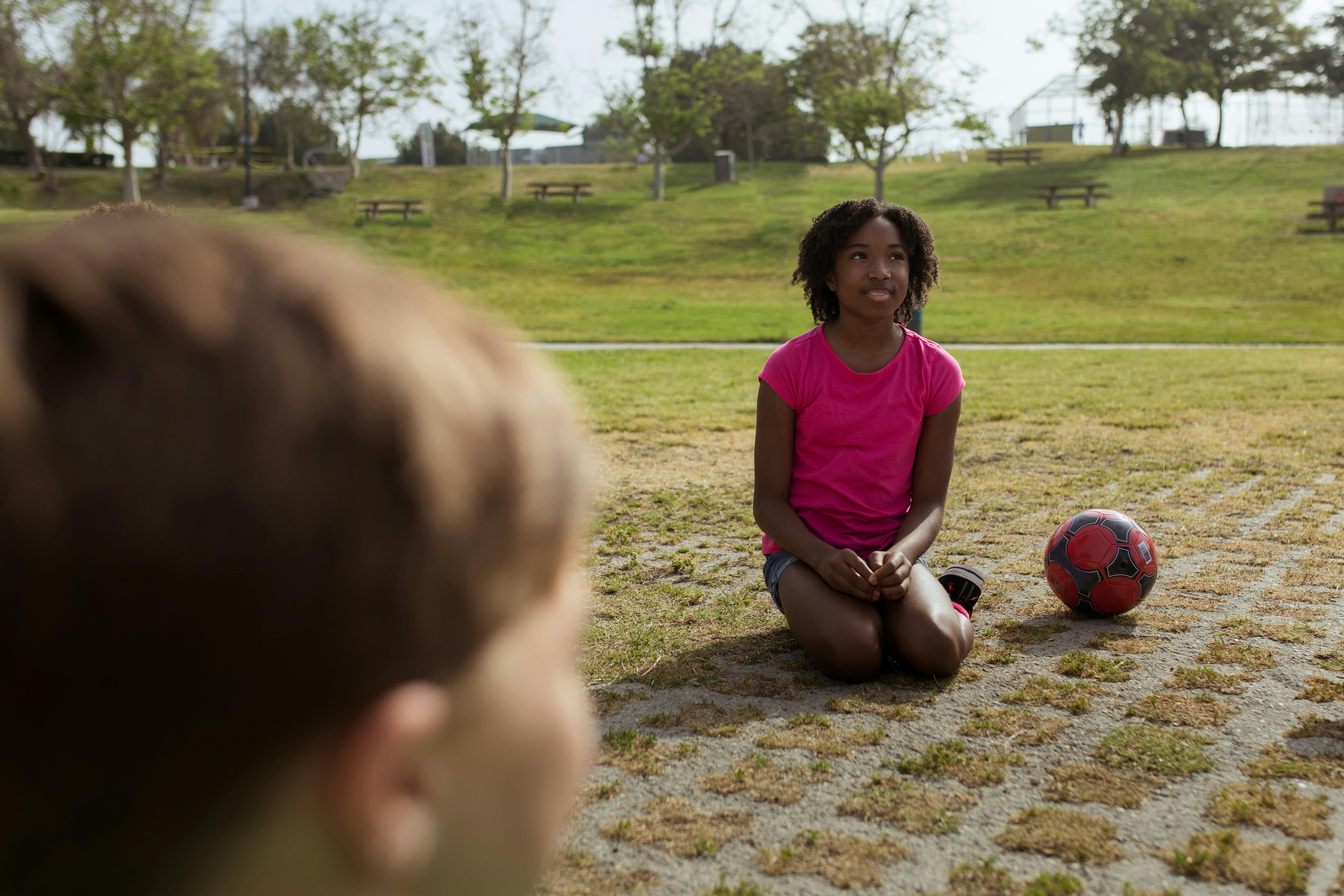 Girl Sitting on a Concrete Bench · Free Stock Photo