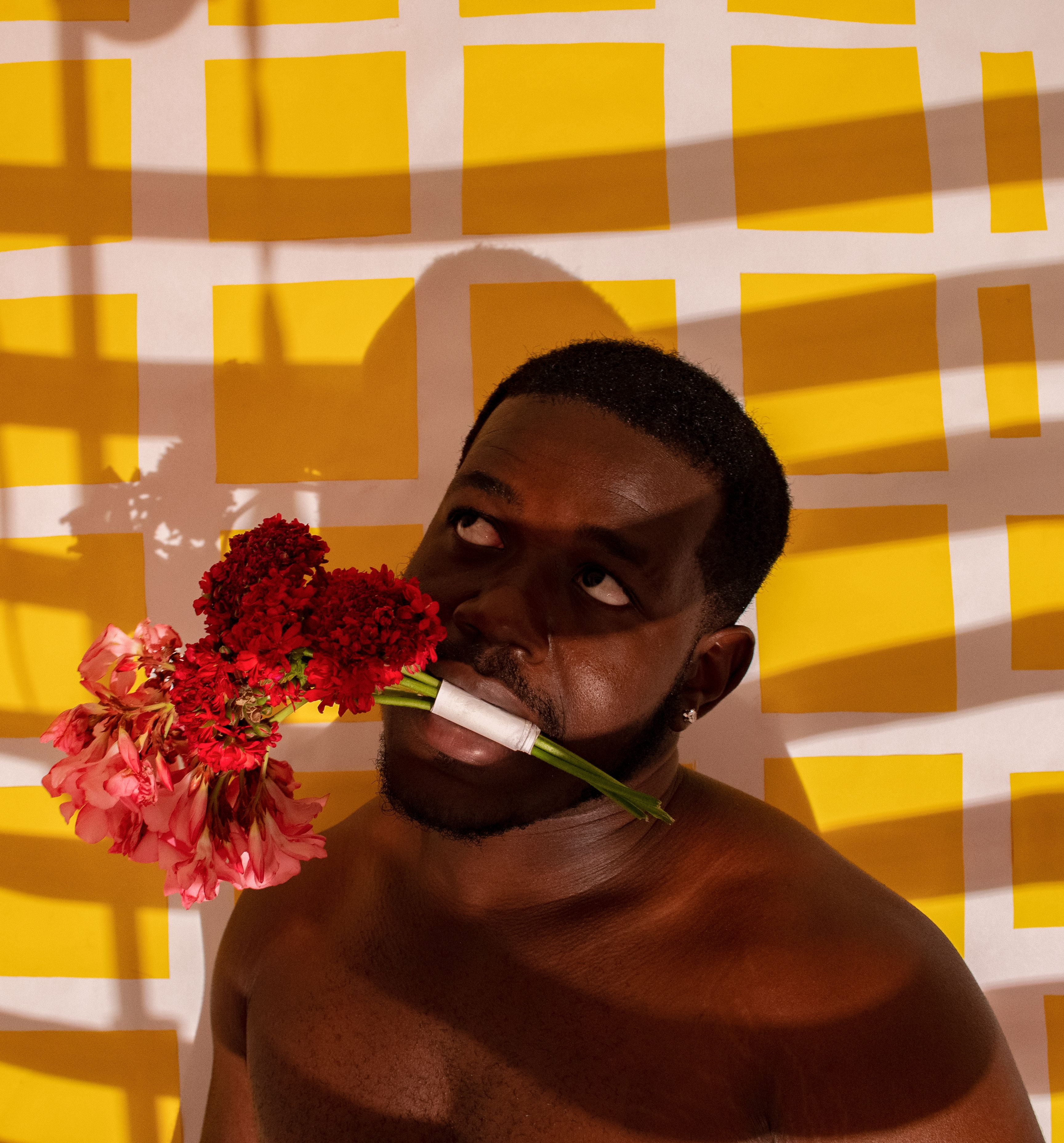 A Man Standing with a Flower · Free Stock Photo