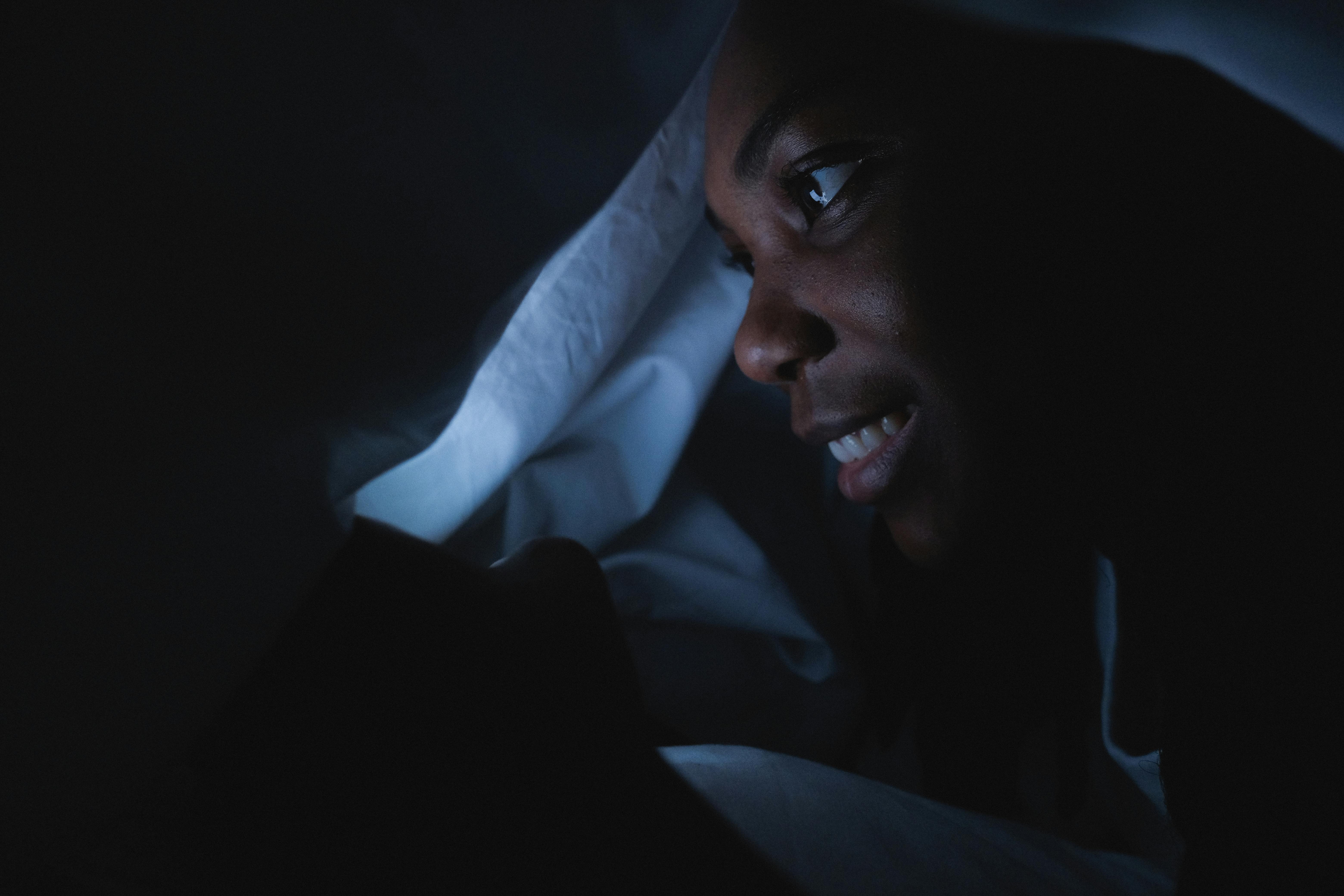 Woman using Mobile Phone in the Dark · Free Stock Photo