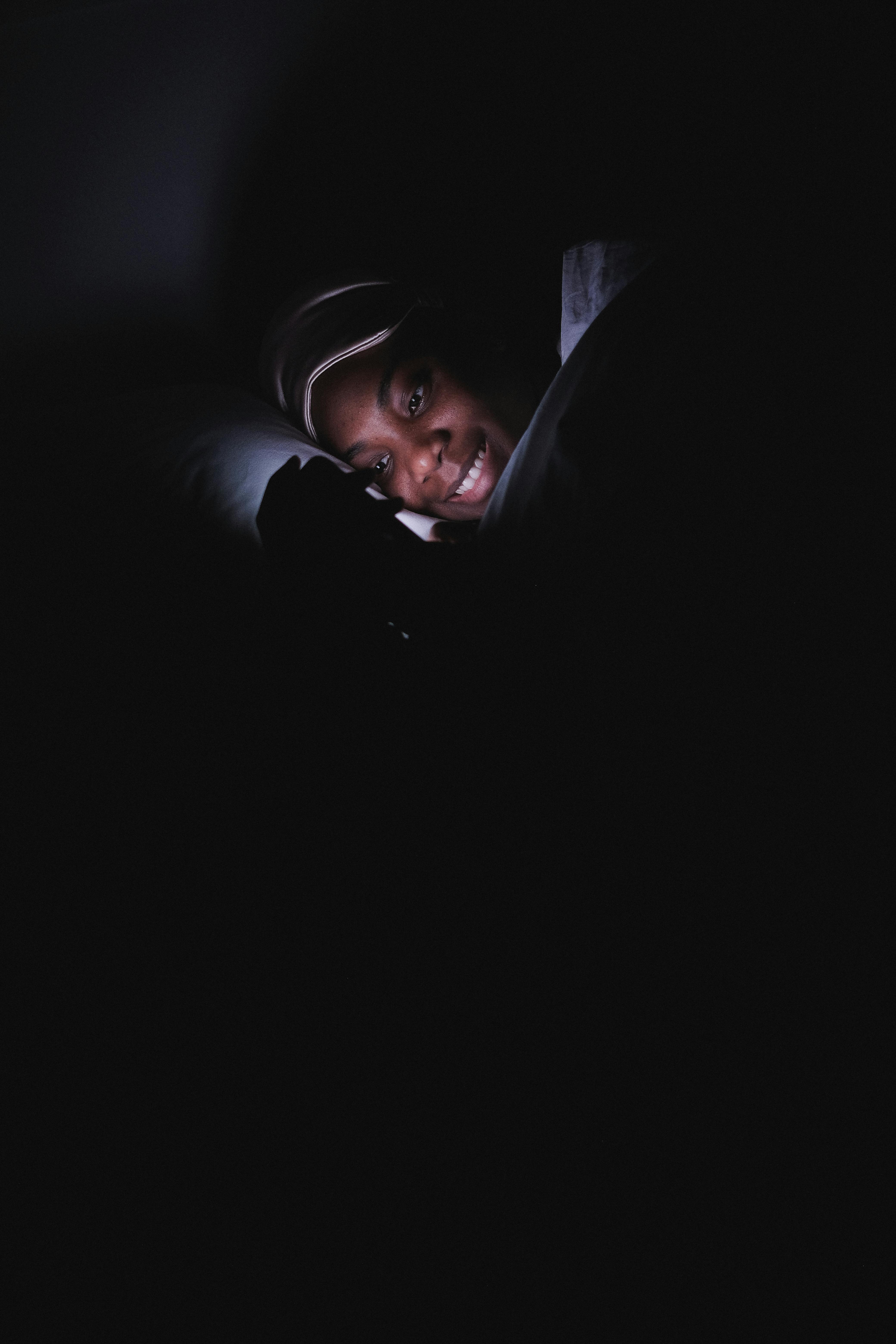 Woman using Mobile Phone in the Dark · Free Stock Photo
