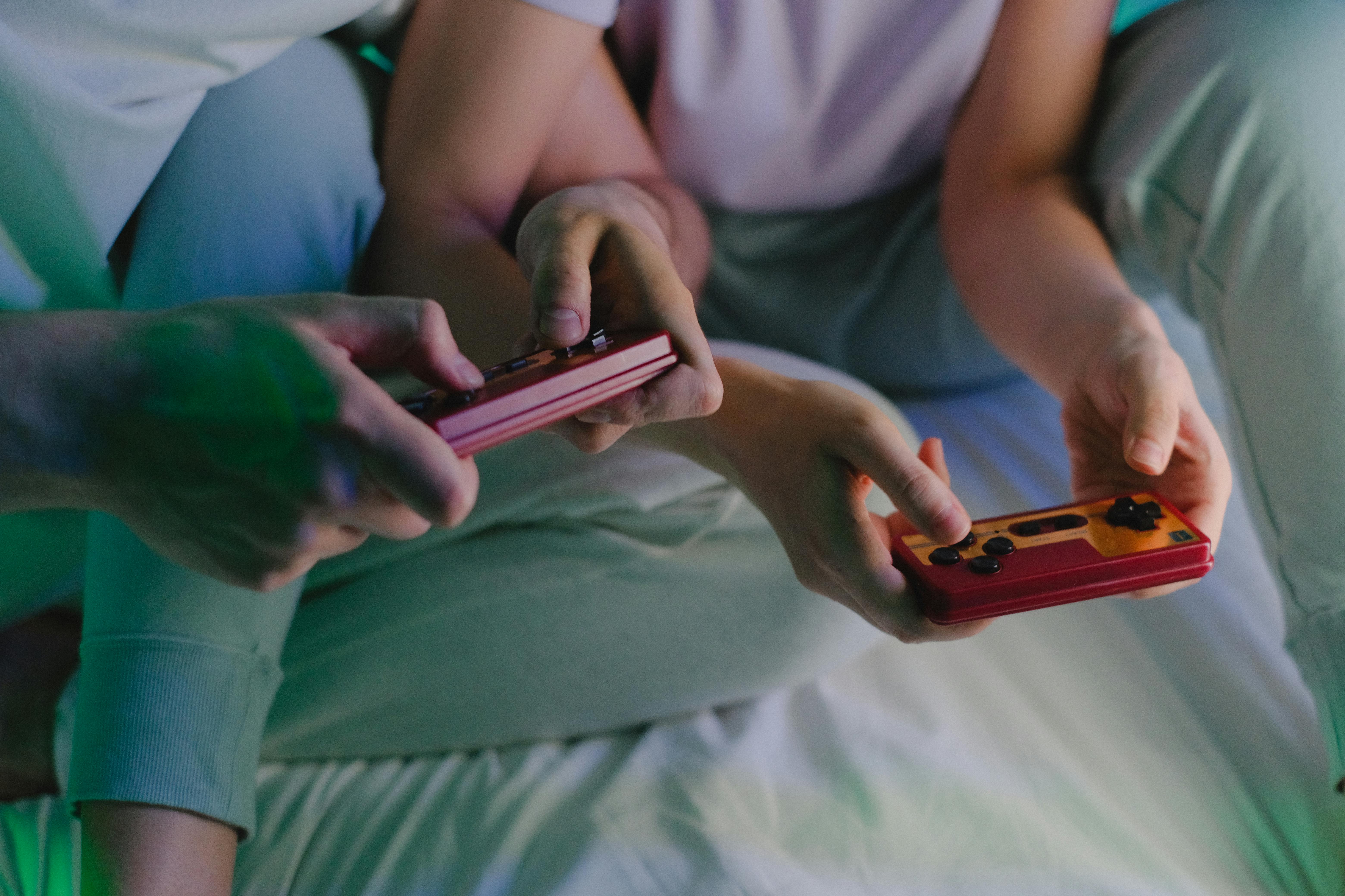 Person Holding Game Controllers · Free Stock Photo