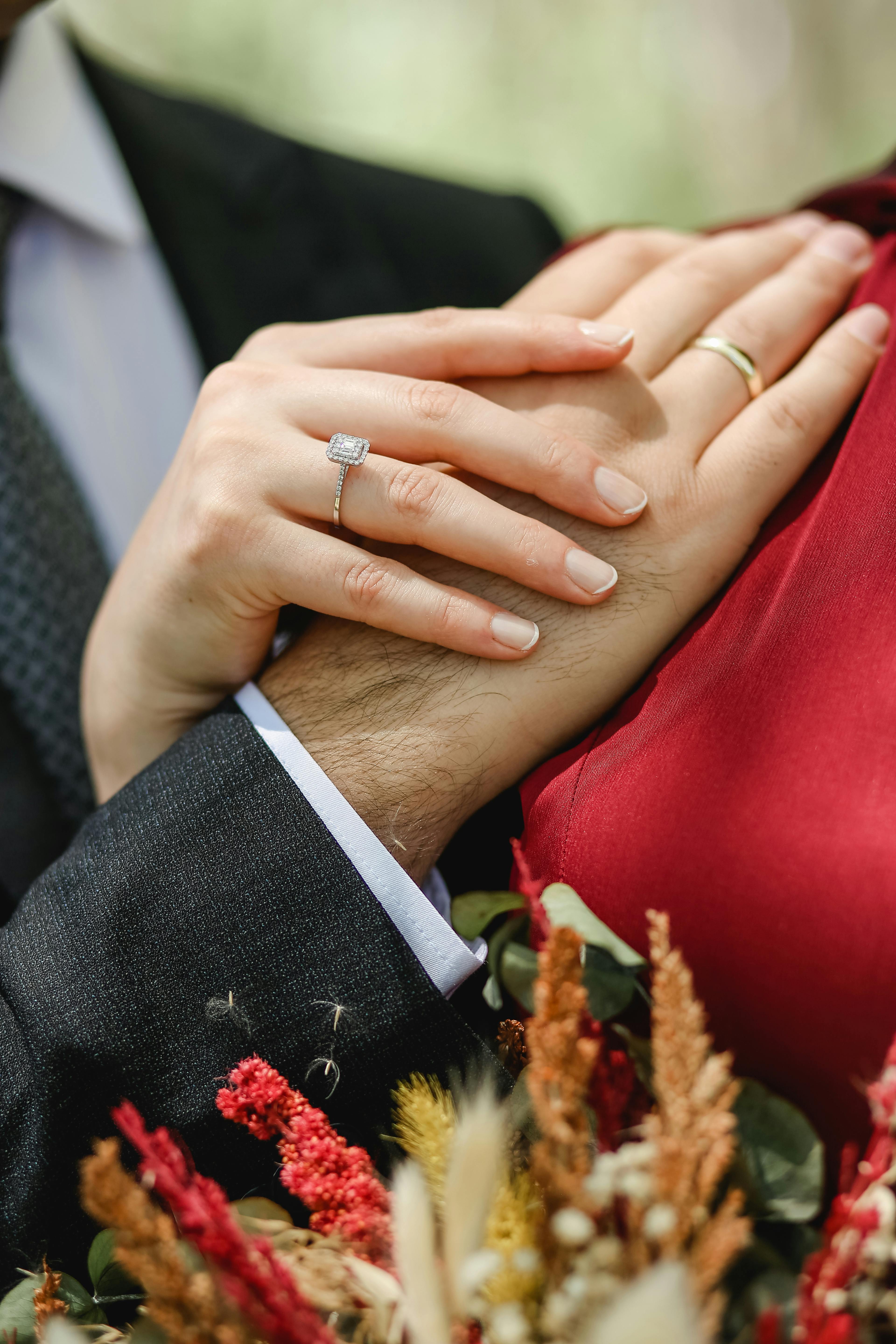 Close Up Photo of Hand with Gold Rings · Free Stock Photo