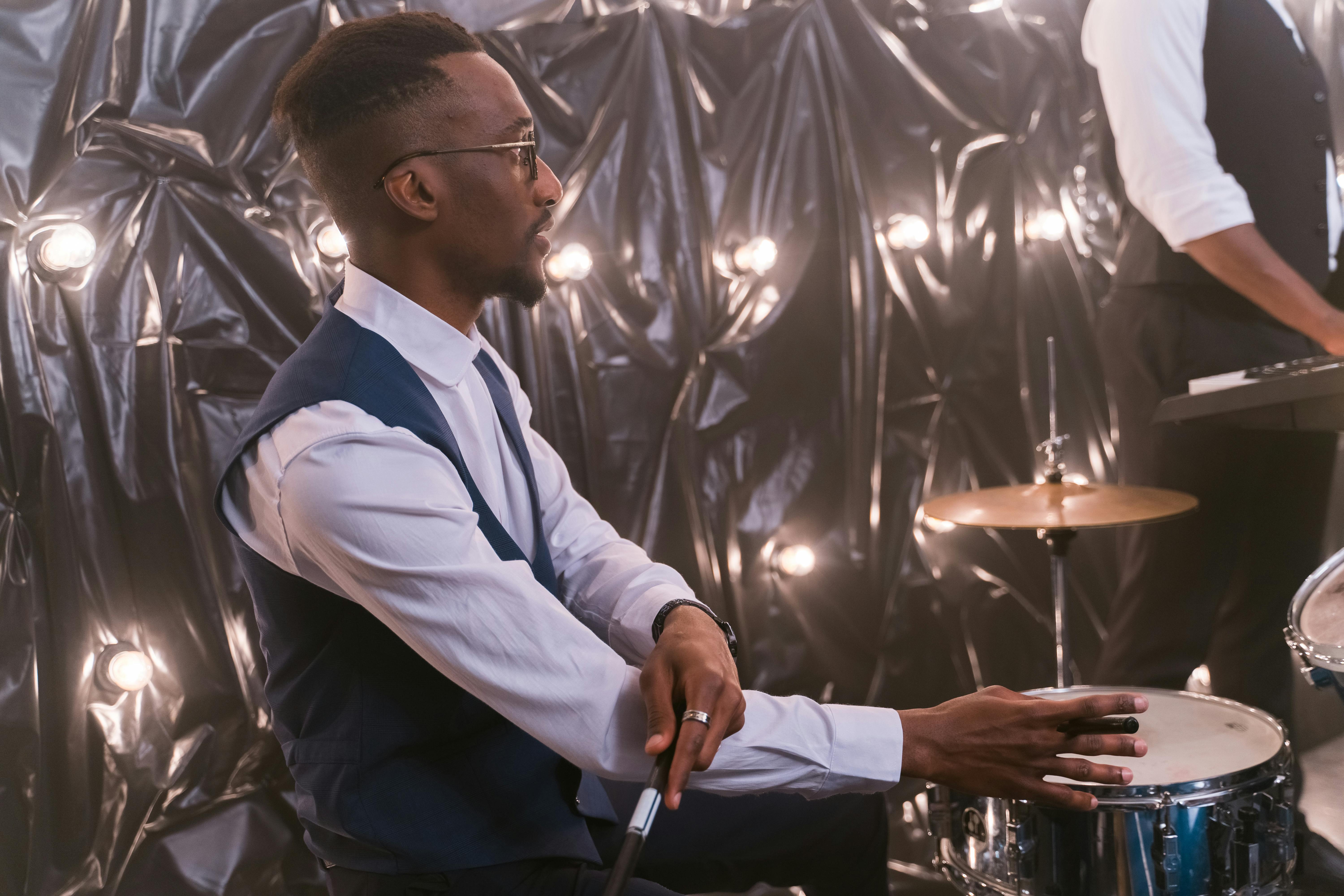 Person Playing on Drums during Daytime · Free Stock Photo
