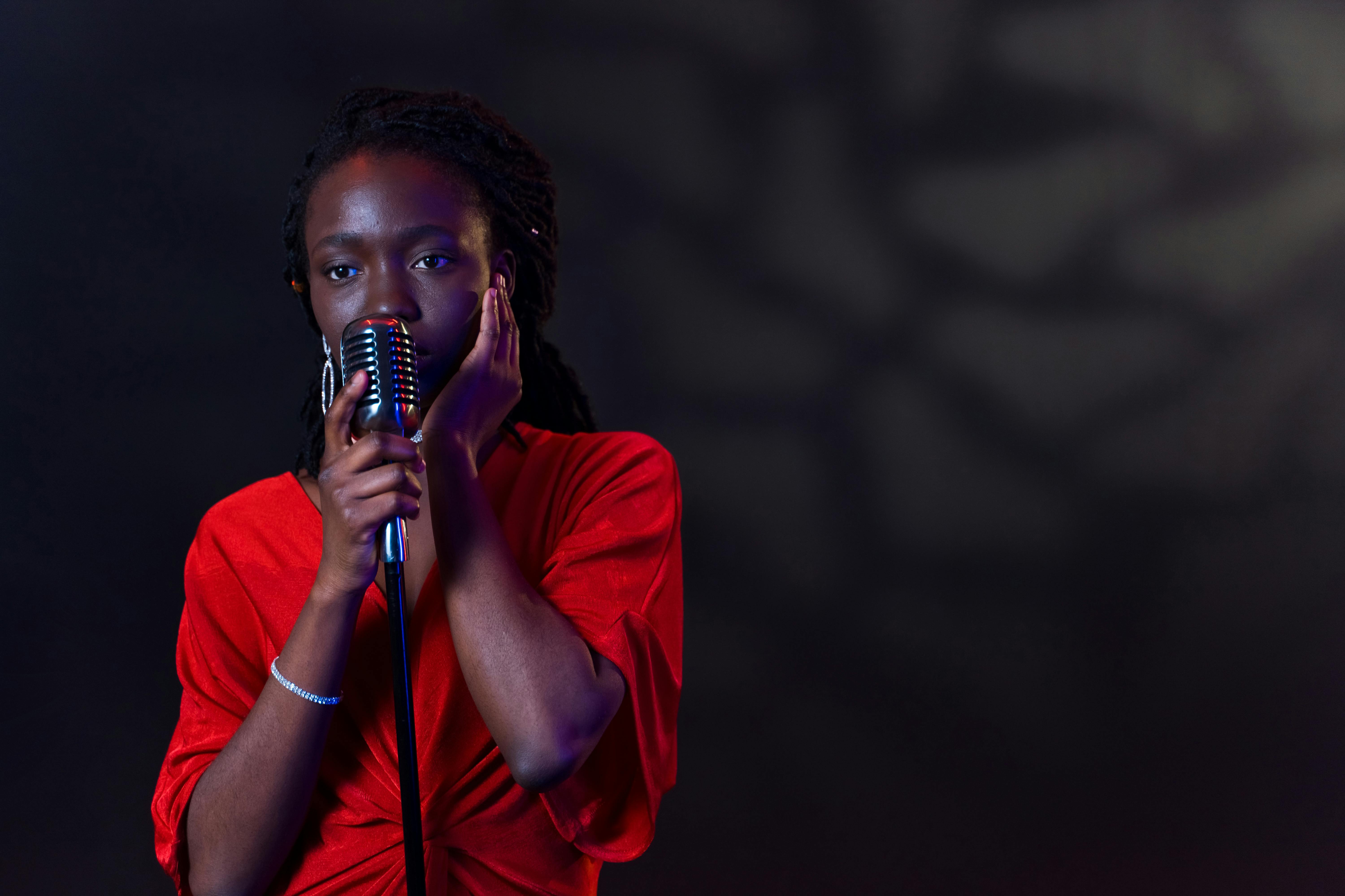 A Woman Singing Emotionally · Free Stock Photo