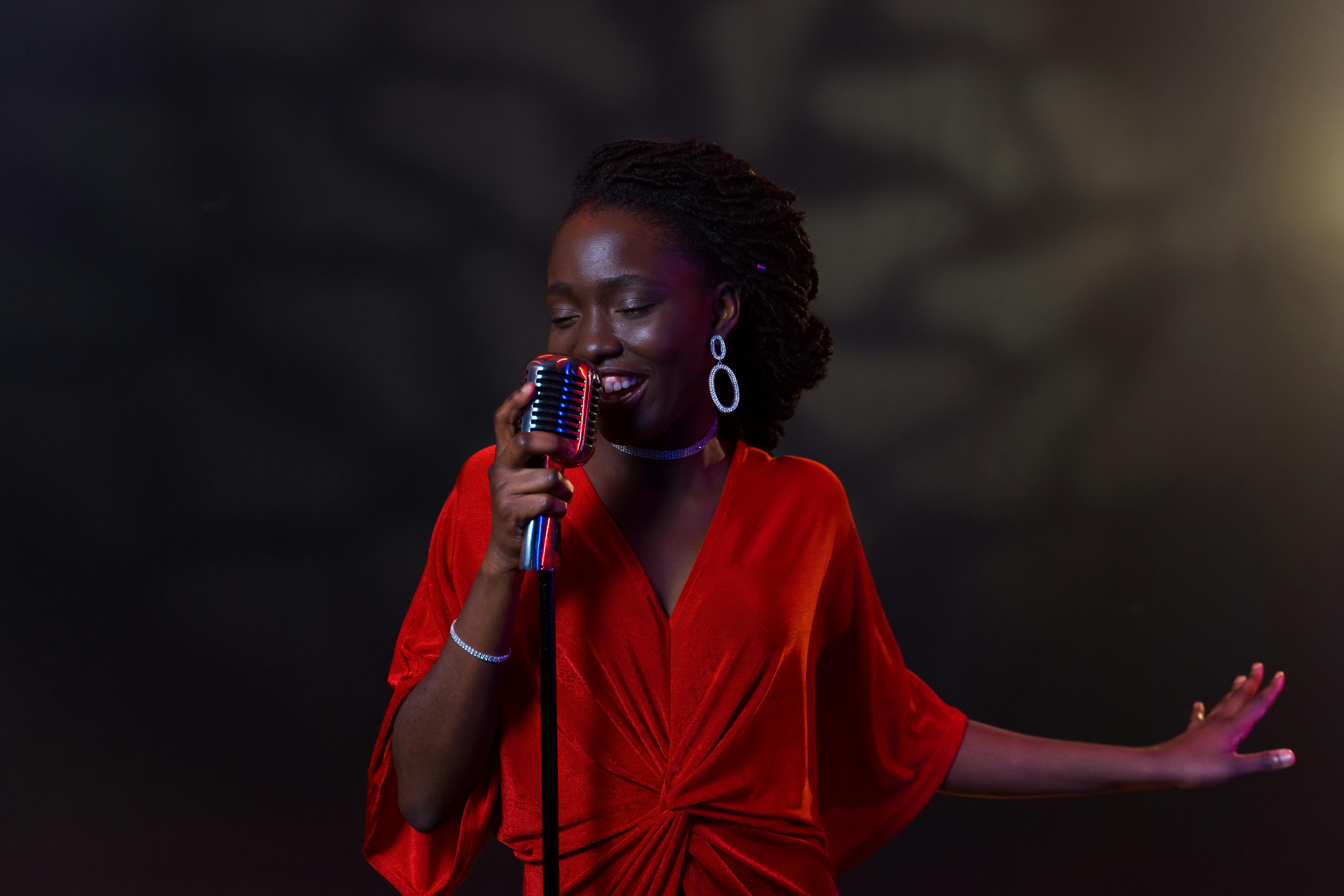 A Female Singer Singing Emotionally · Free Stock Photo