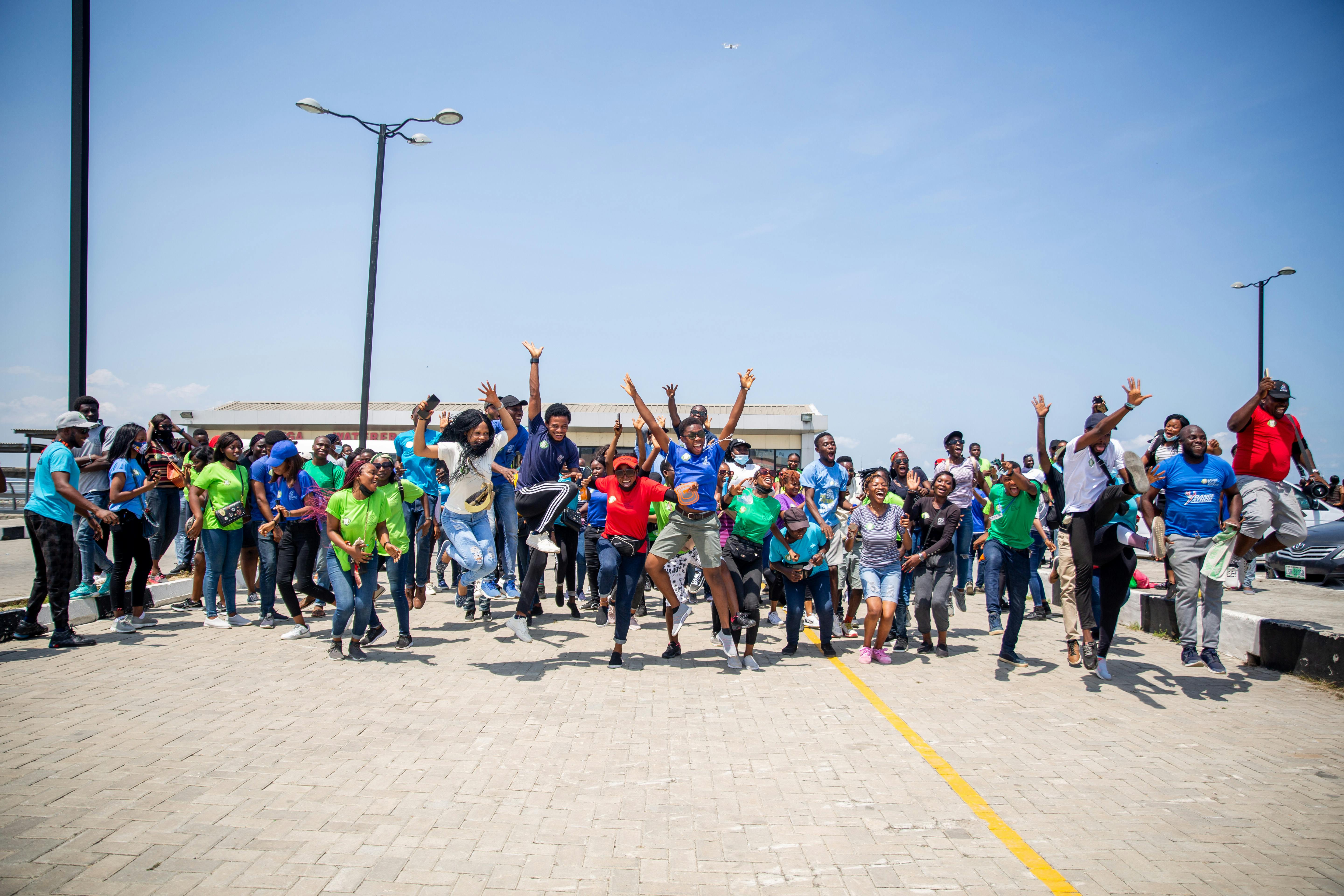 A Group of People Jumping Together · Free Stock Photo