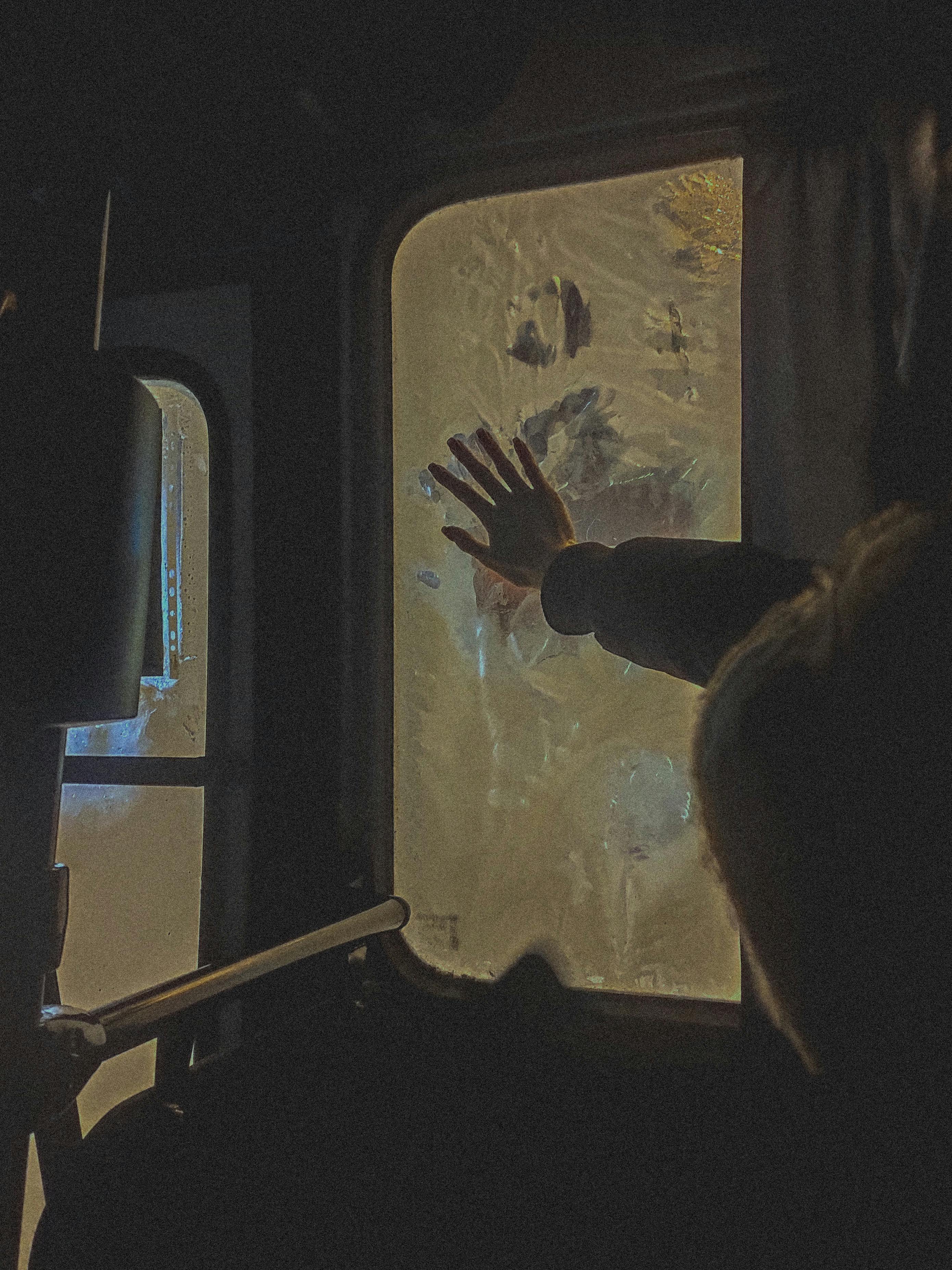 Hand Touching Window · Free Stock Photo