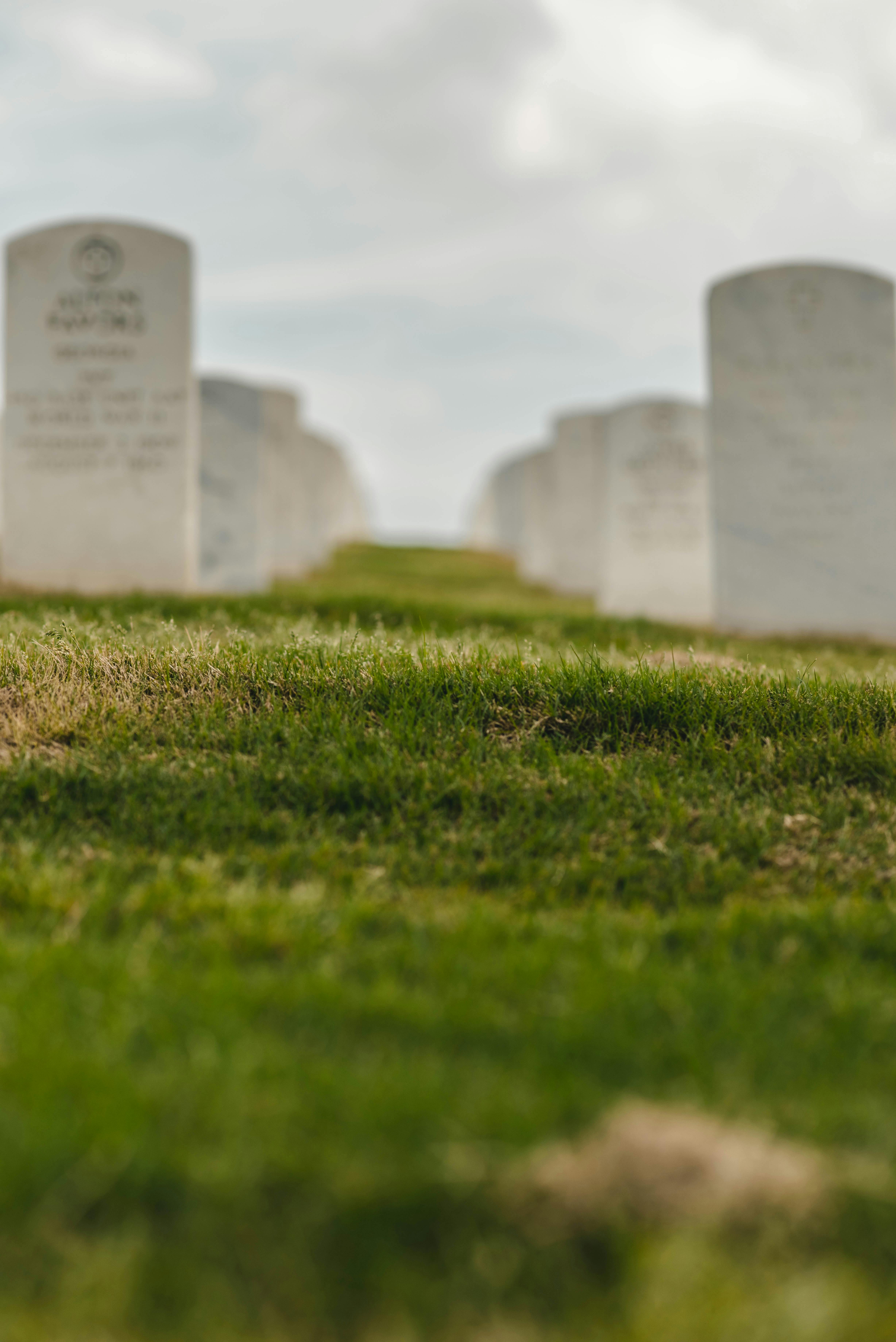 A Man Walking in a Cemetery · Free Stock Photo