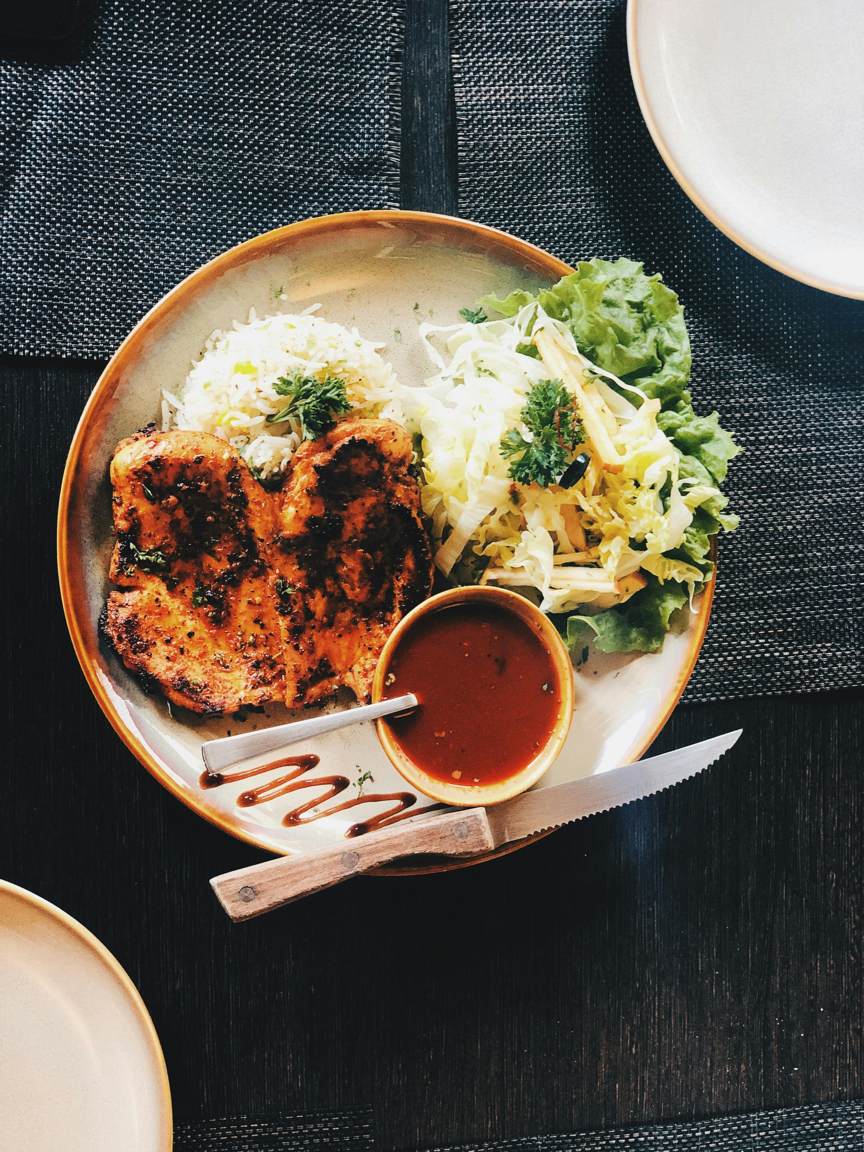 High-Angle Shot of People Eating Sea Food on Red Table · Free Stock Photo
