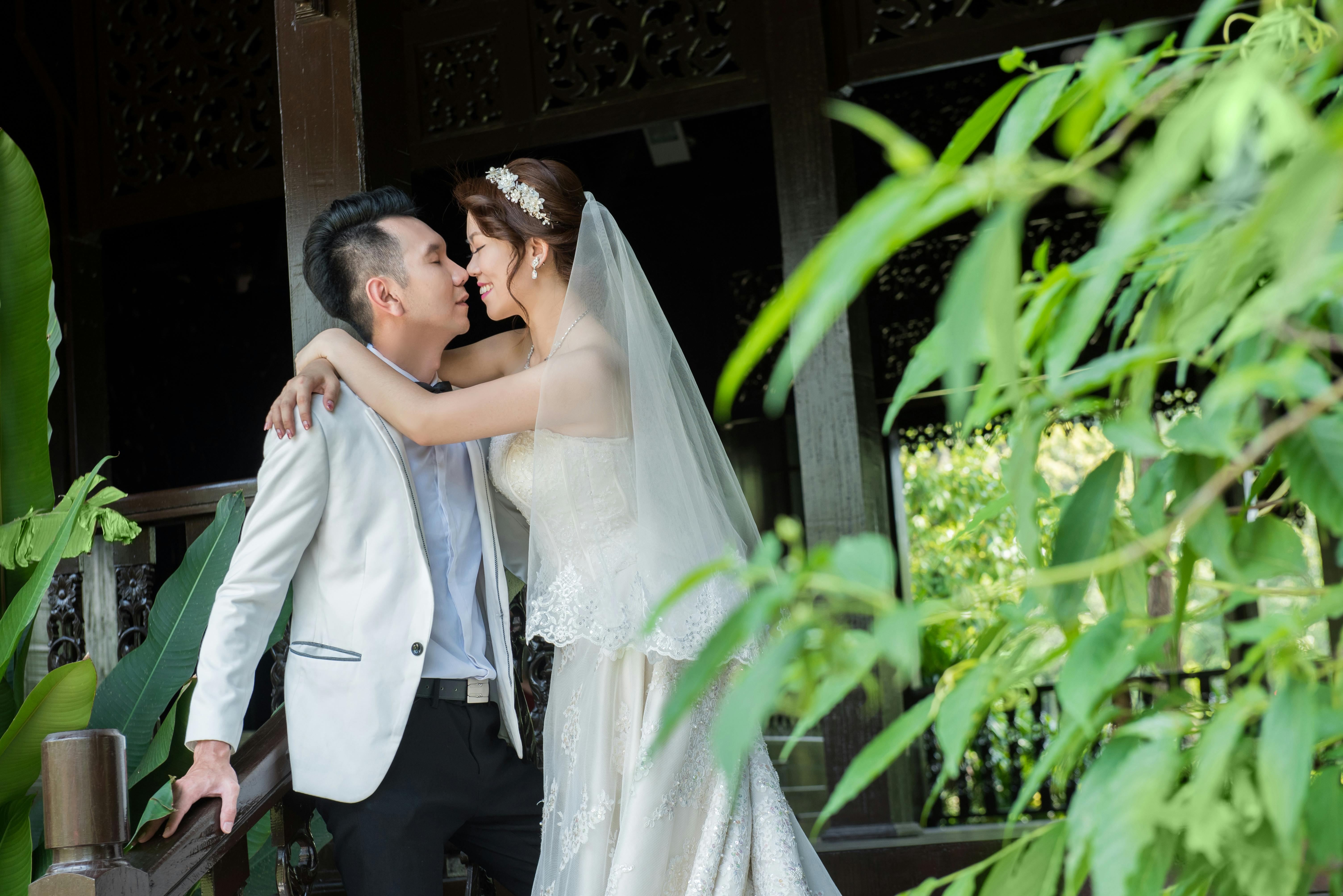 Groom Kissing Bride Neck · Free Stock Photo