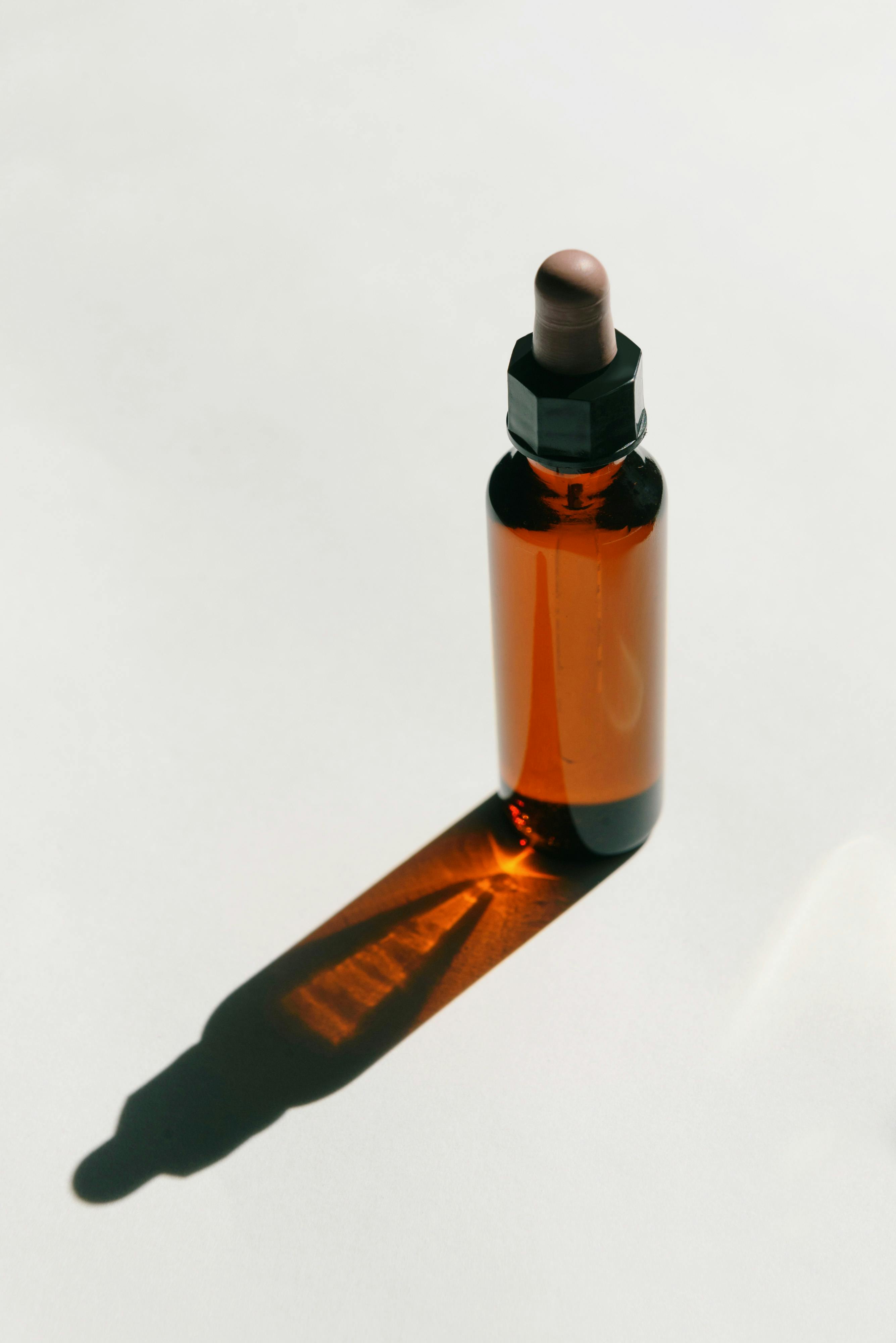 Open Flask and Leaves near · Free Stock Photo