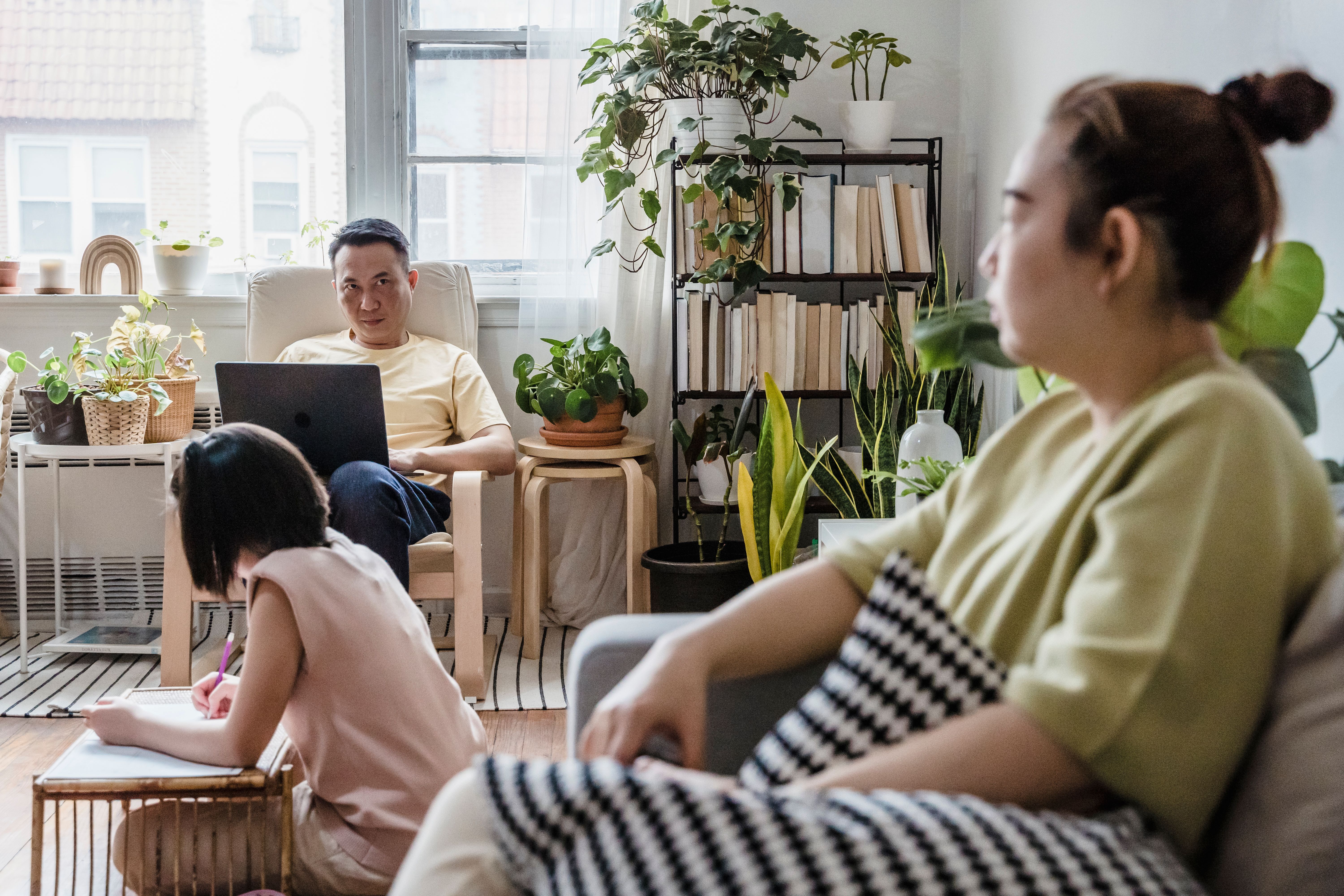 A Family Sitting in the Living Room · Free Stock Photo