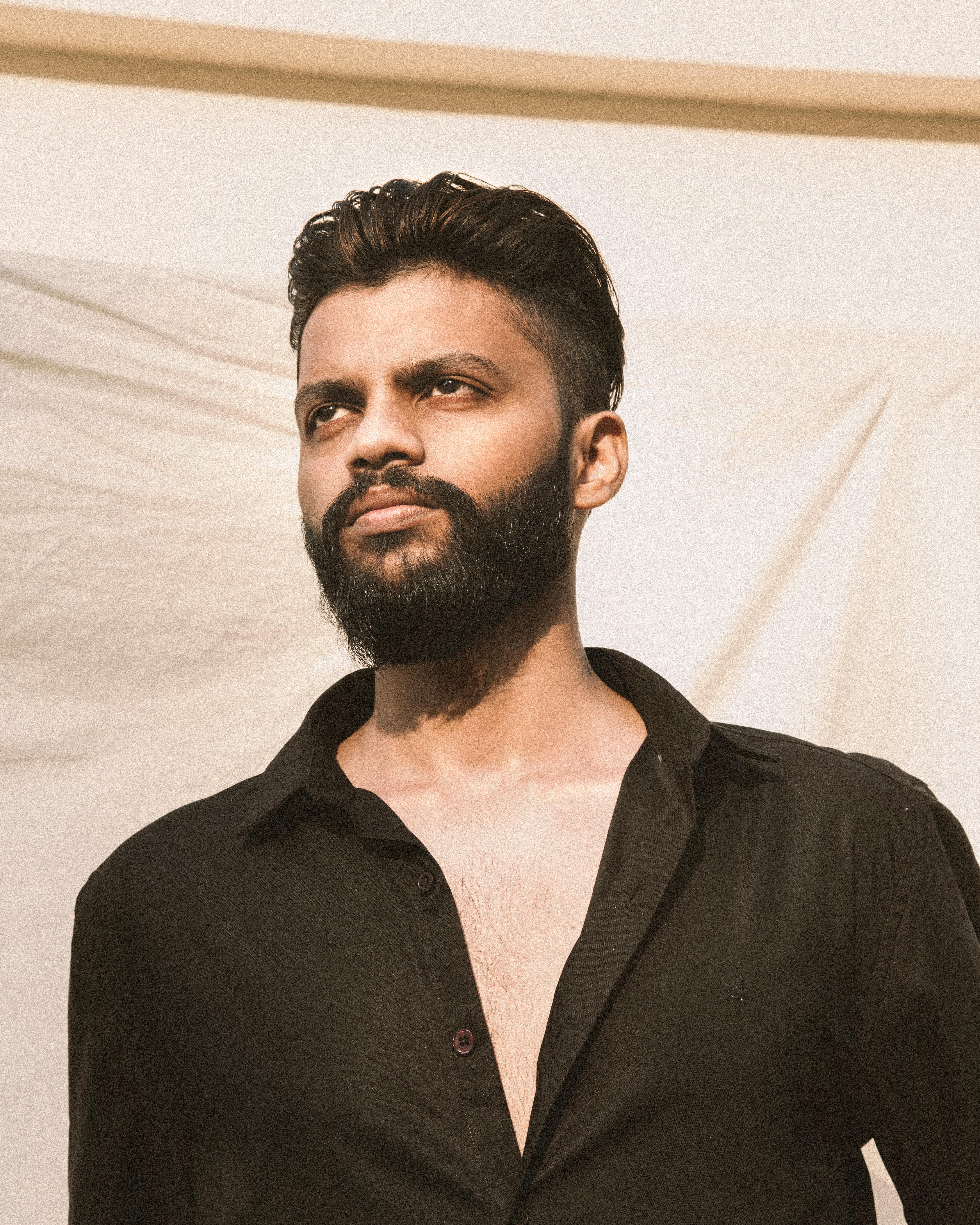 Low-Angle Shot of a Man Under a Building · Free Stock Photo