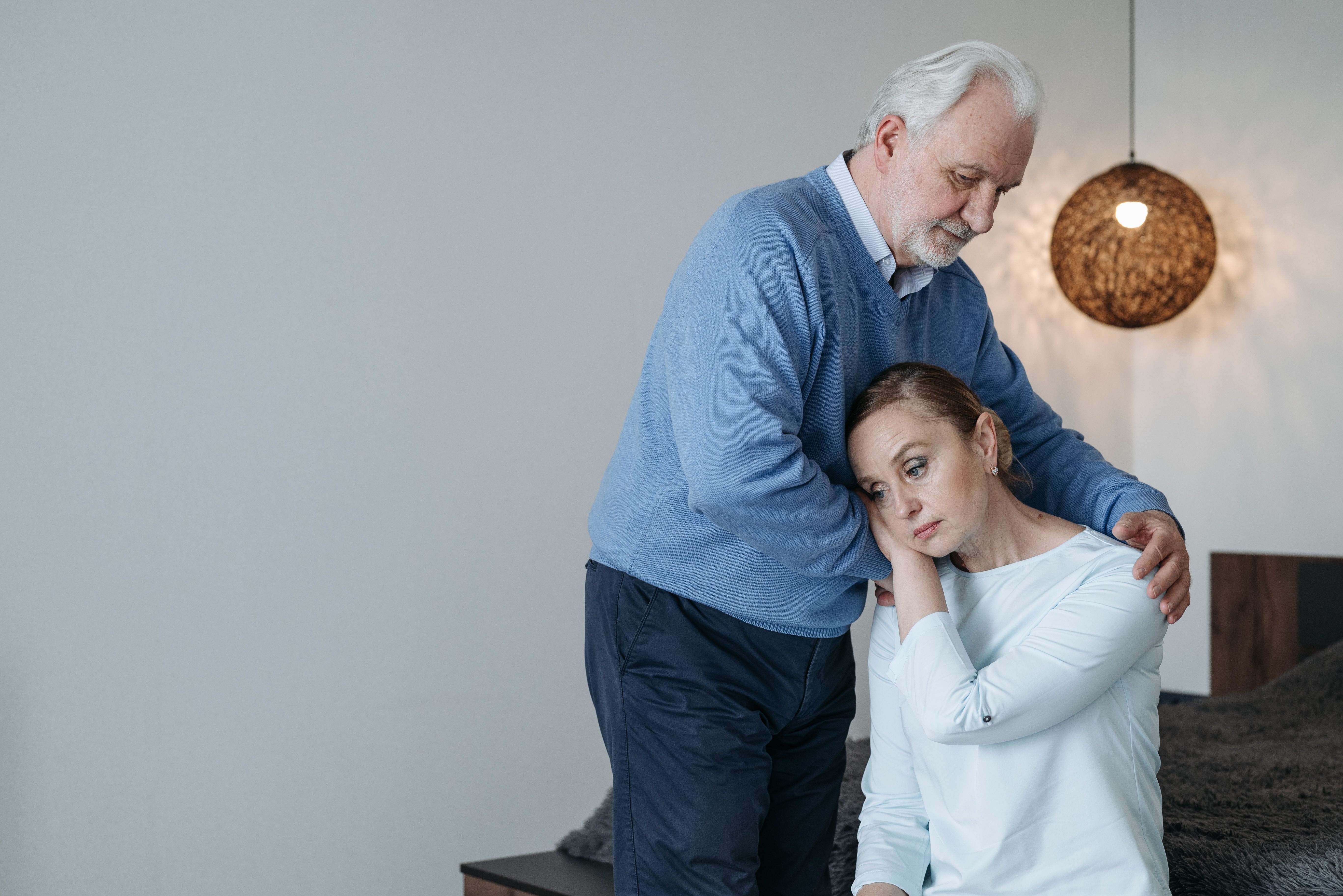 Woman Leaning on an Elderly Man's Chest · Free Stock Photo