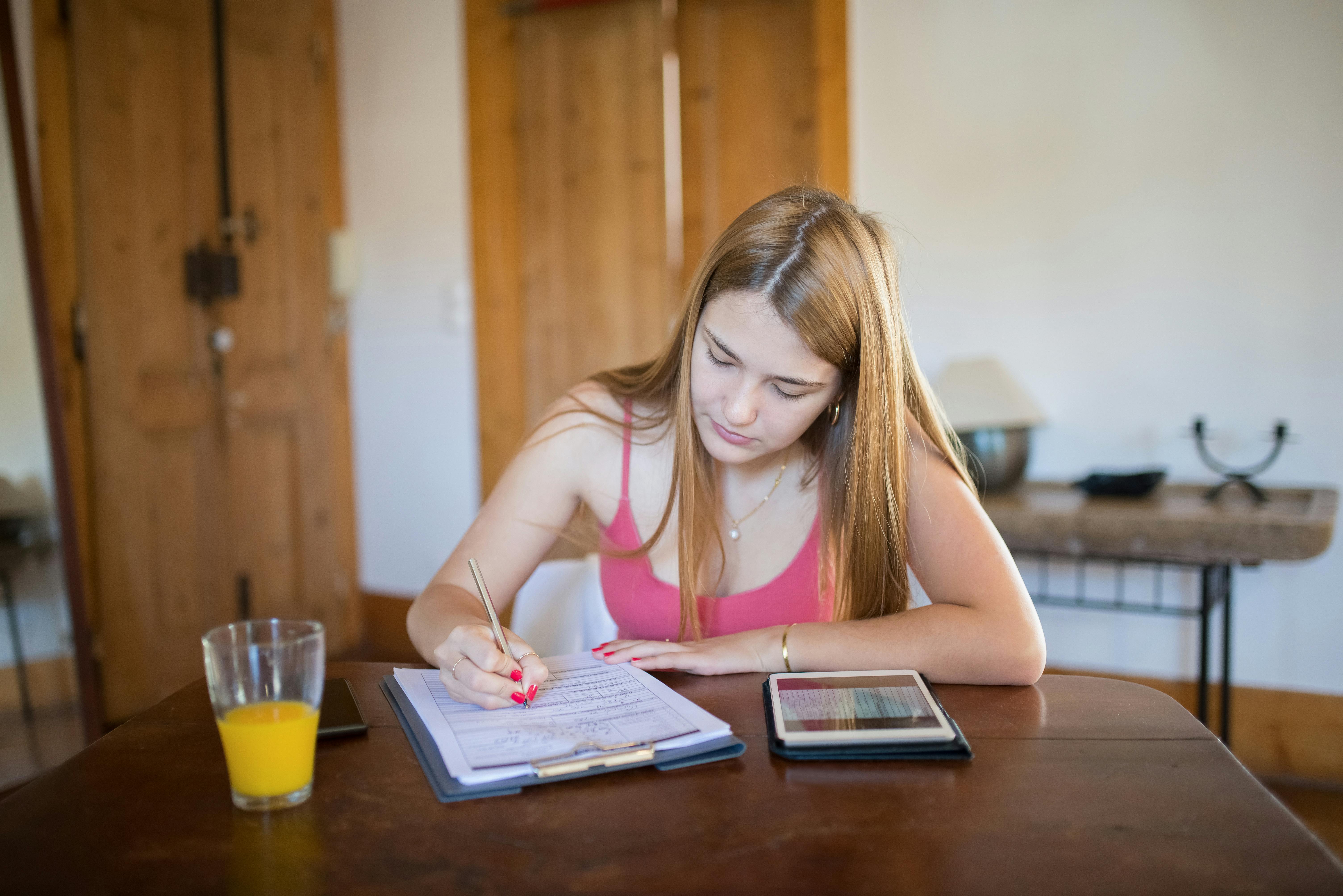 Woman in Writing on Table · Free Stock Photo