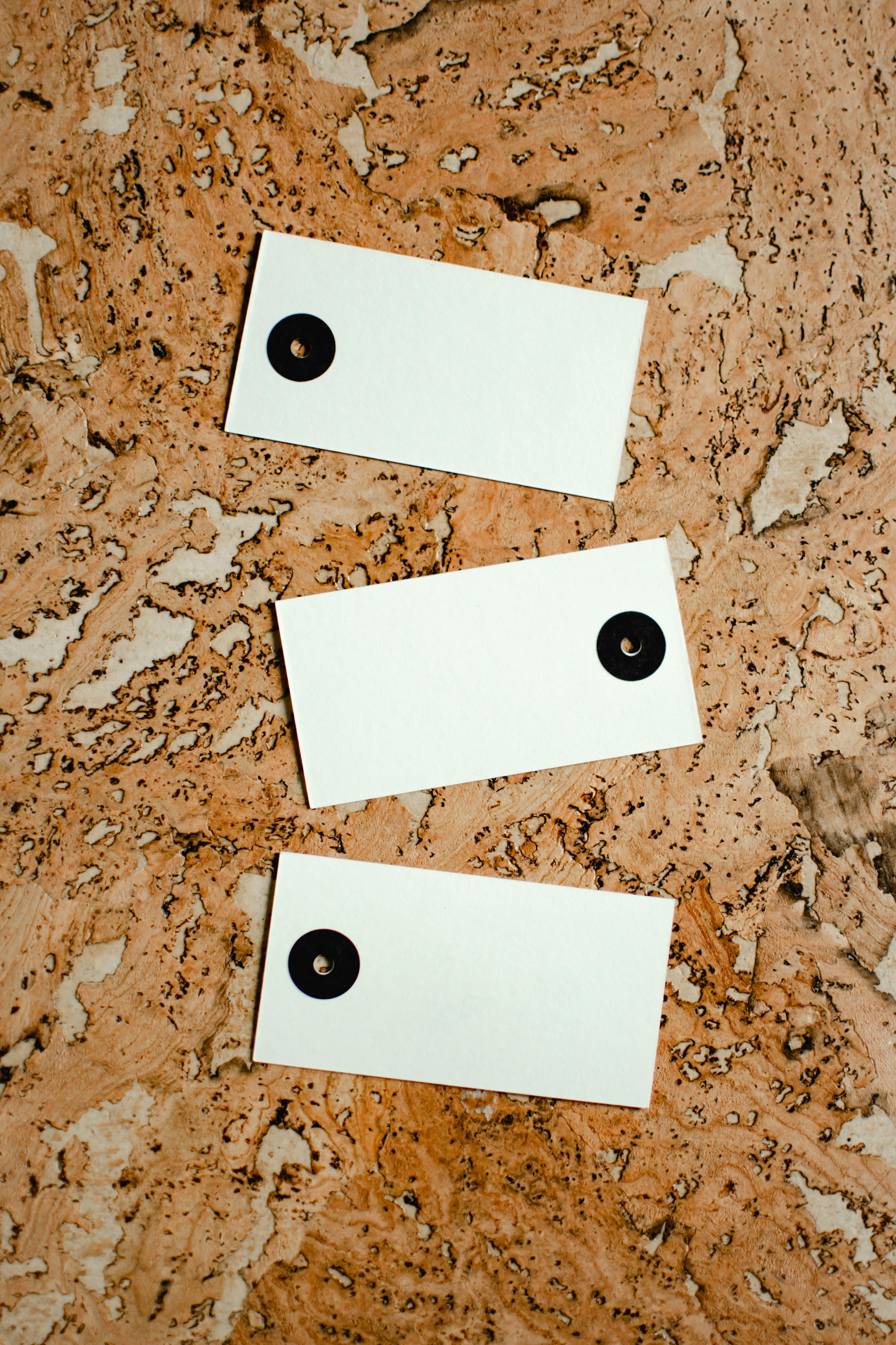 White Plain Paper Tags on a Flat Surface · Free Stock Photo