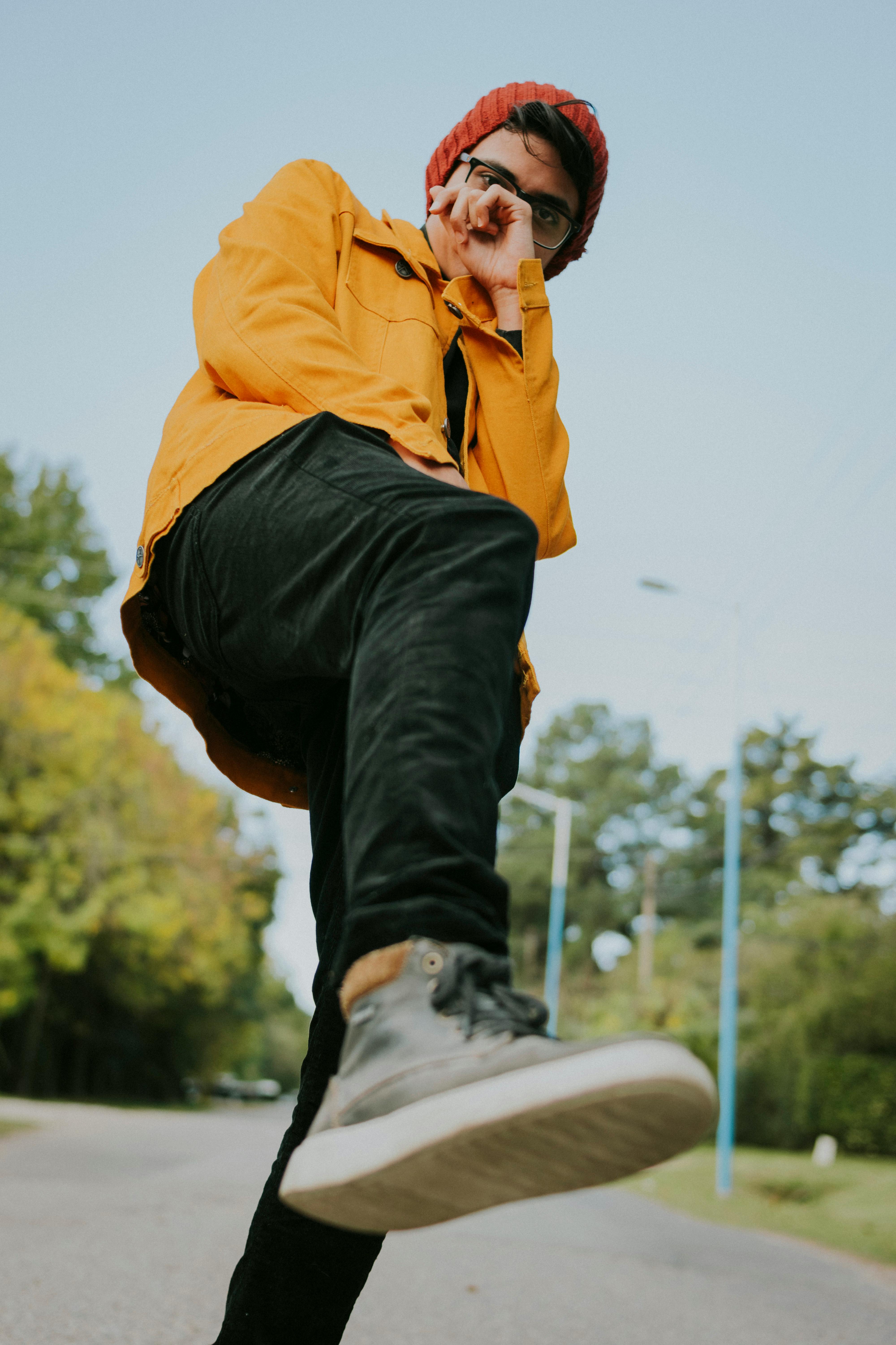 Man With Yellow Huddy With Cap Photos Download The Best Free Man With Yellow Huddy With Cap