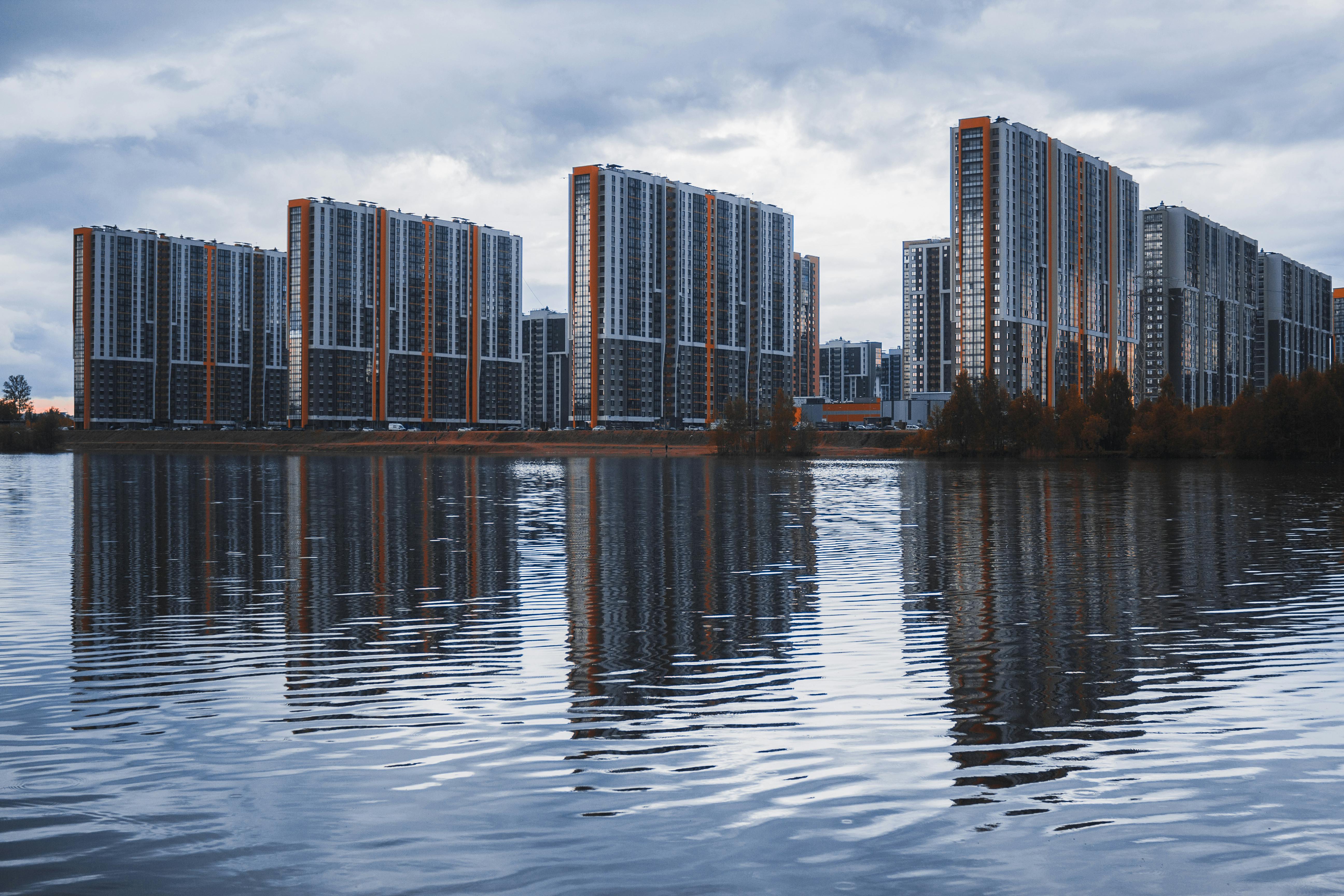 Tall Glass Buildings near a Body of Water · Free Stock Photo