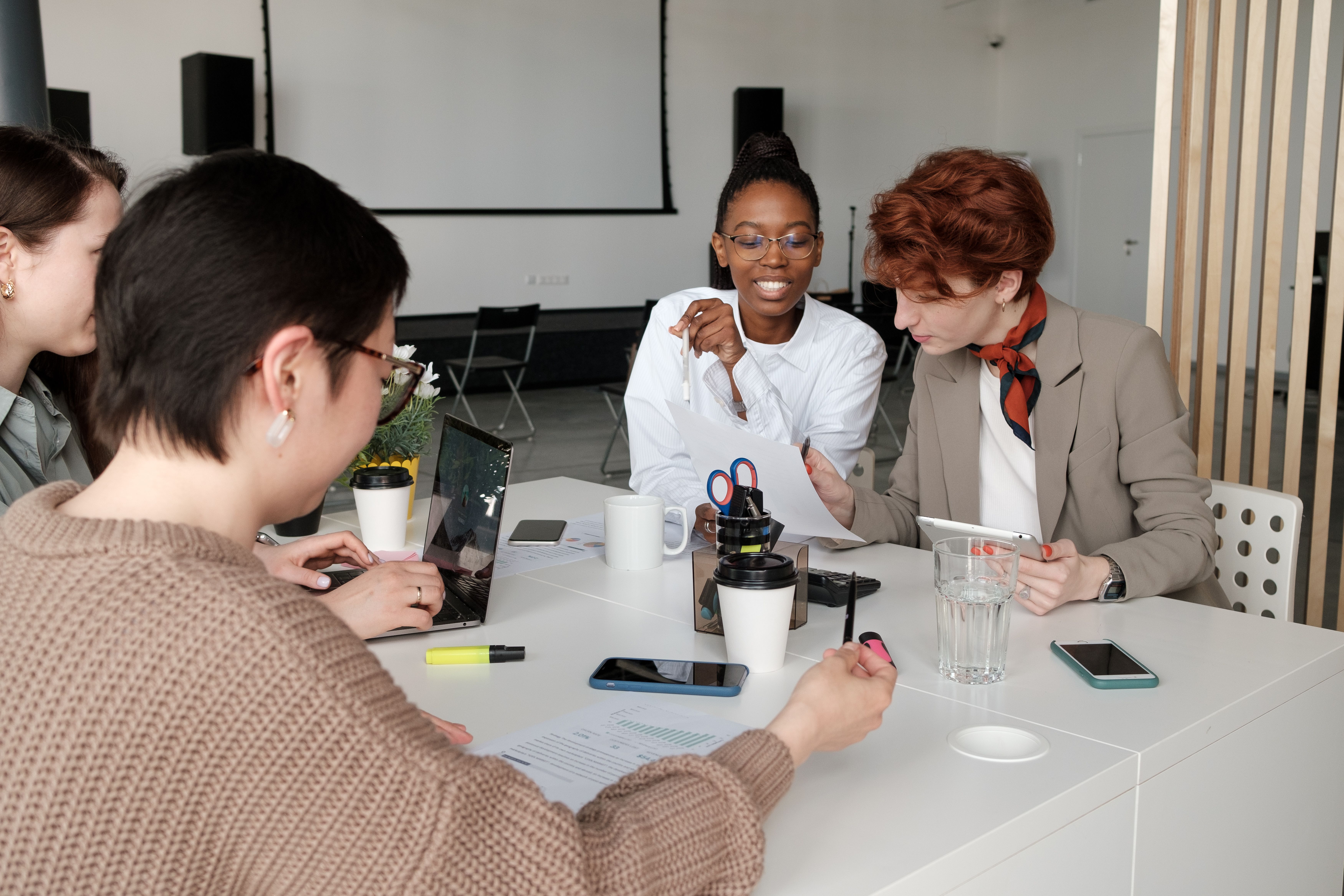 Smiling Women at Work · Free Stock Photo