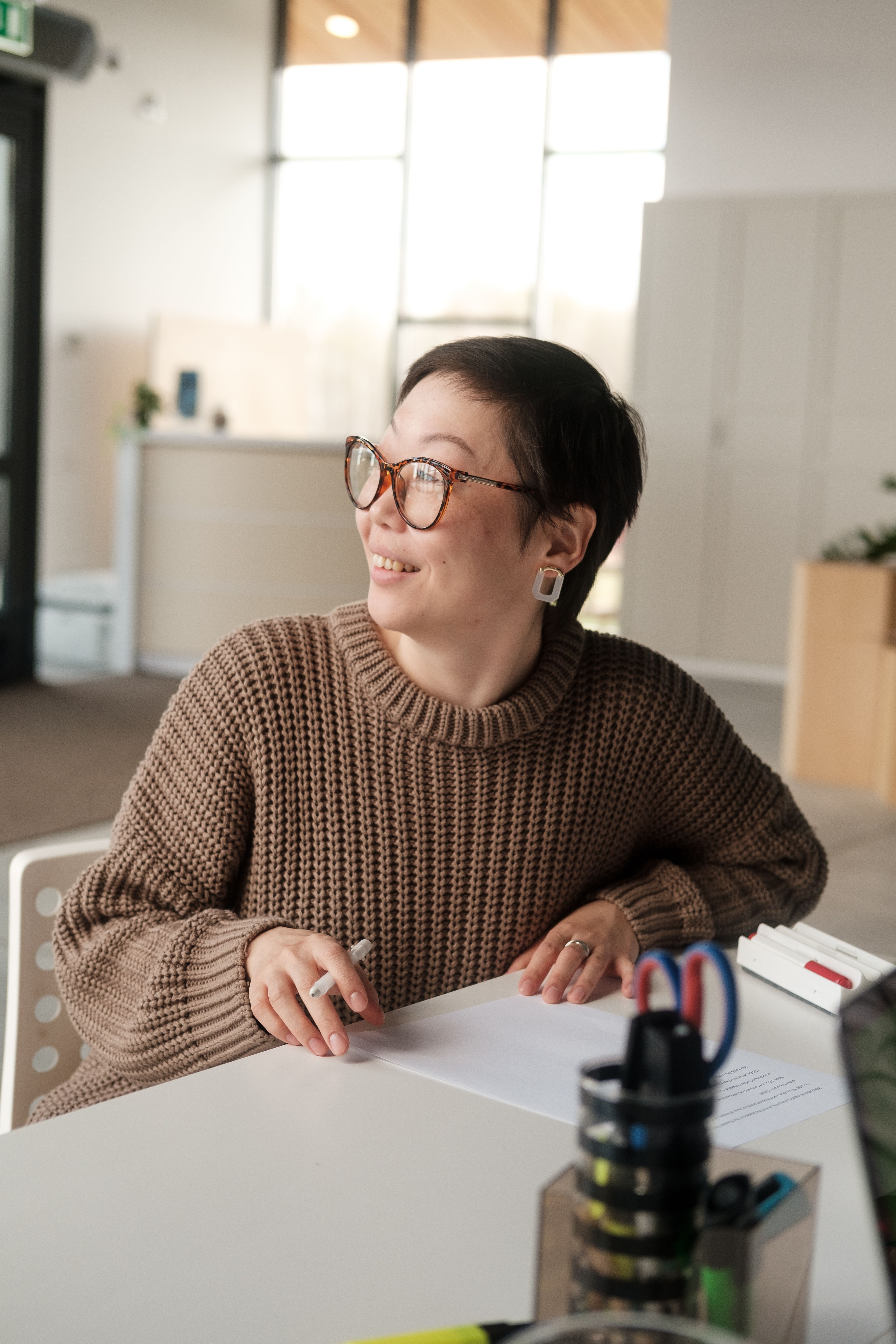 Smiling Woman at Work · Free Stock Photo