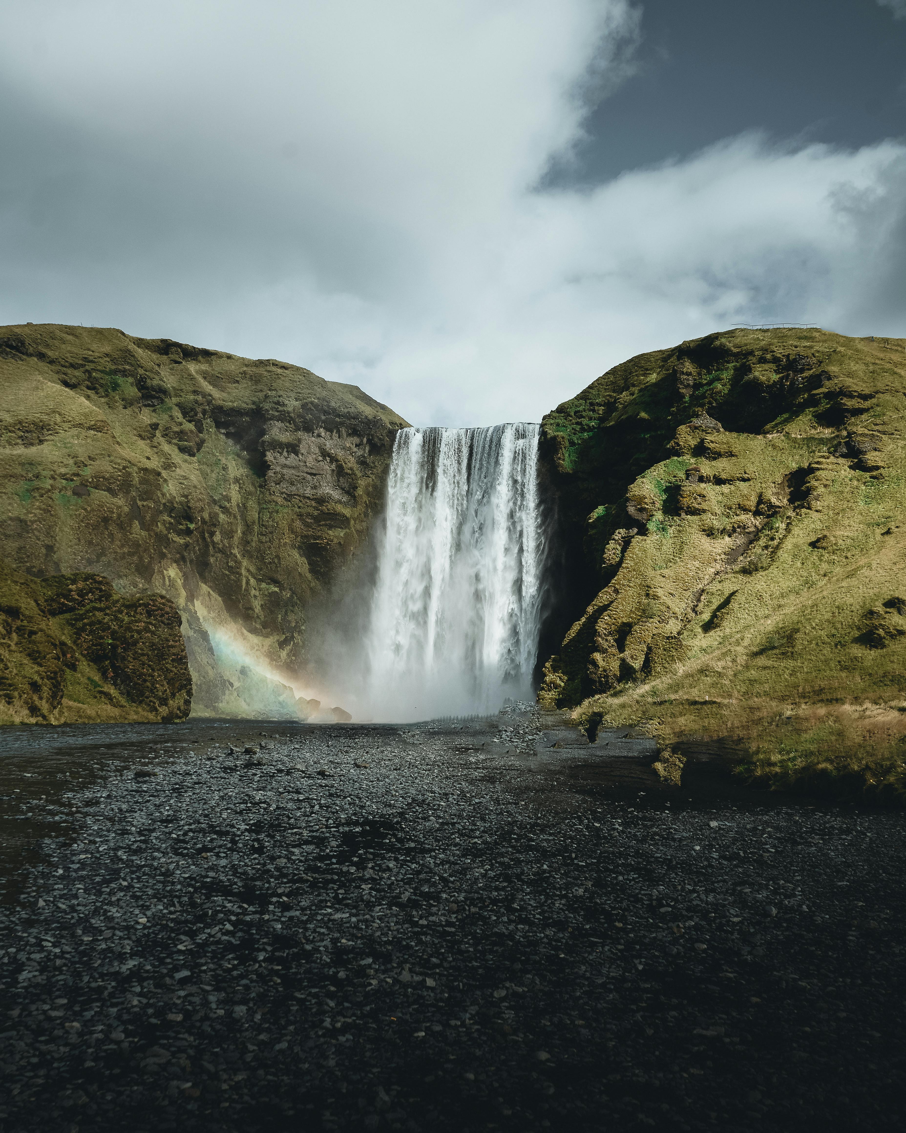 Waterfalls Under Cloudy Sky · Free Stock Photo