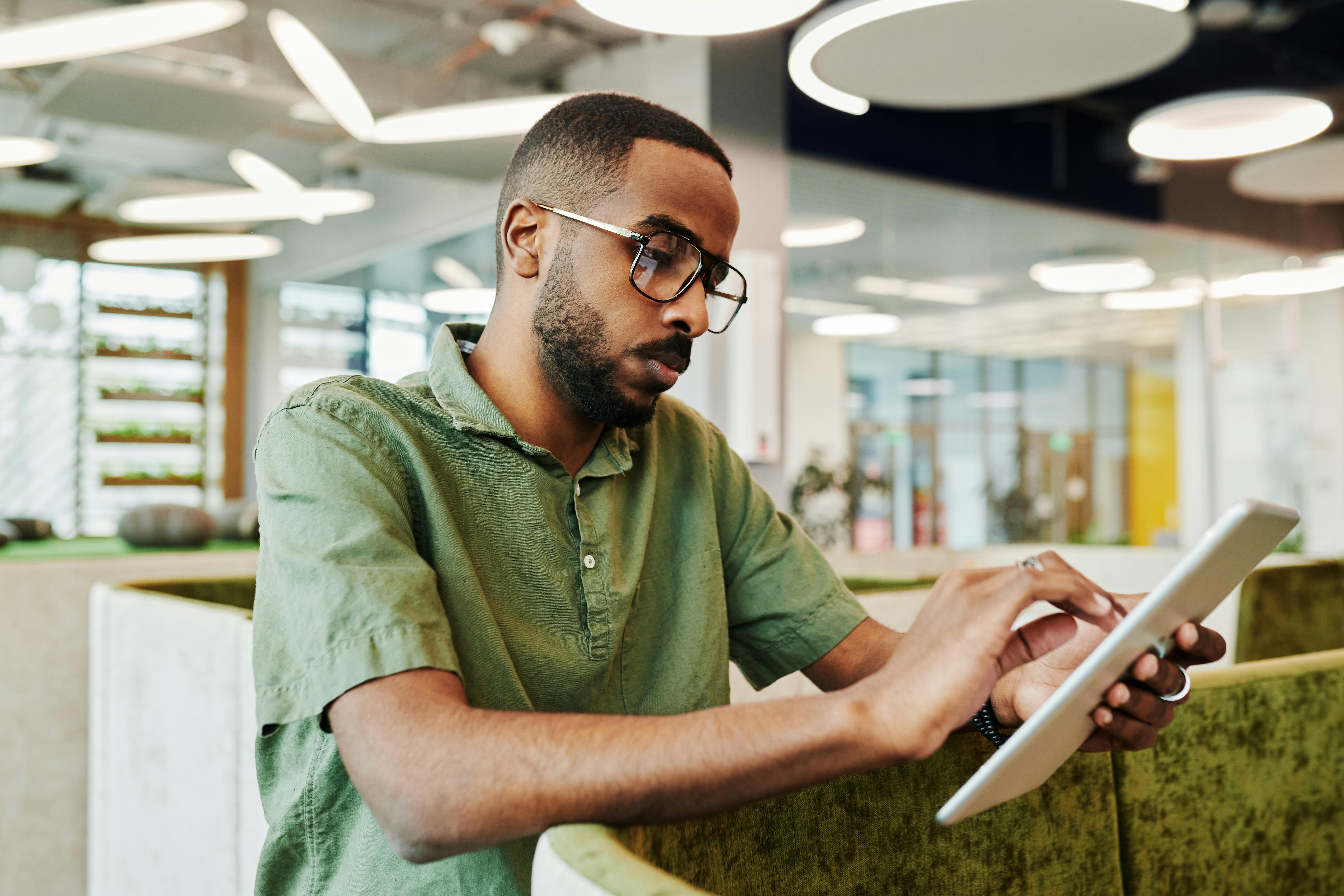 A Man Using a Tablet · Free Stock Photo