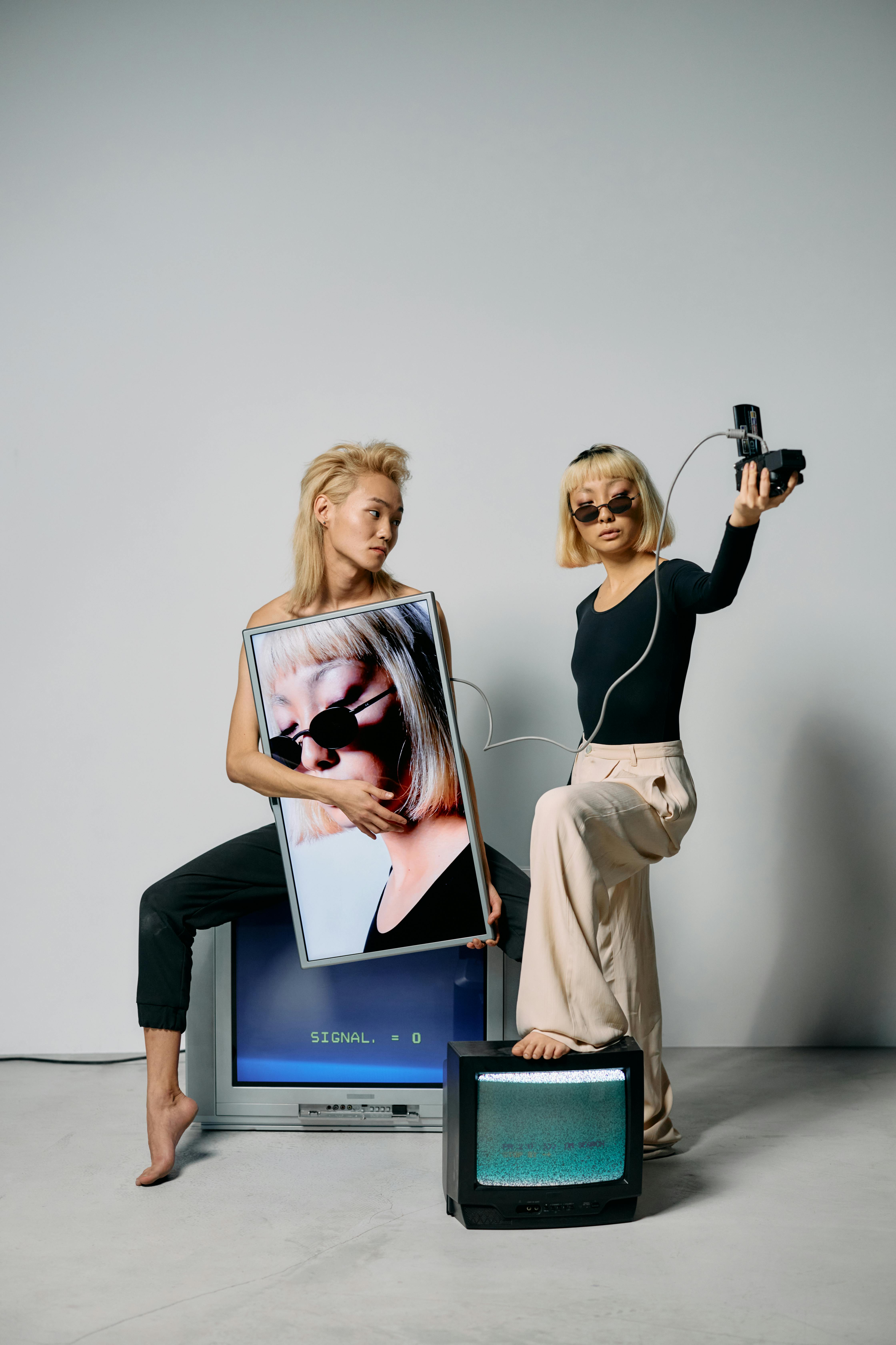 Photo of Woman Sitting on a Television · Free Stock Photo