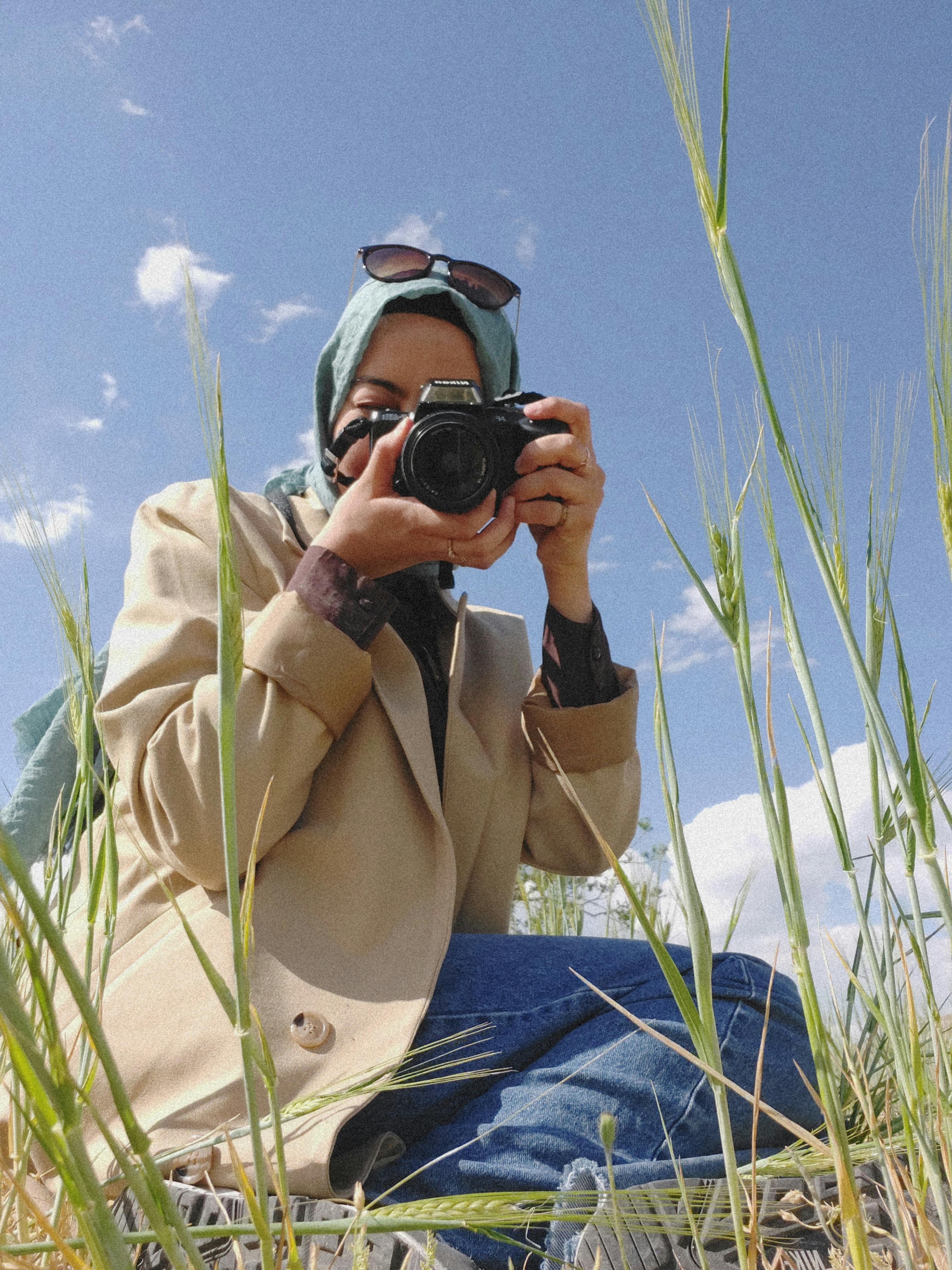 Person Taking a Photo Using Dslr Camera · Free Stock Photo