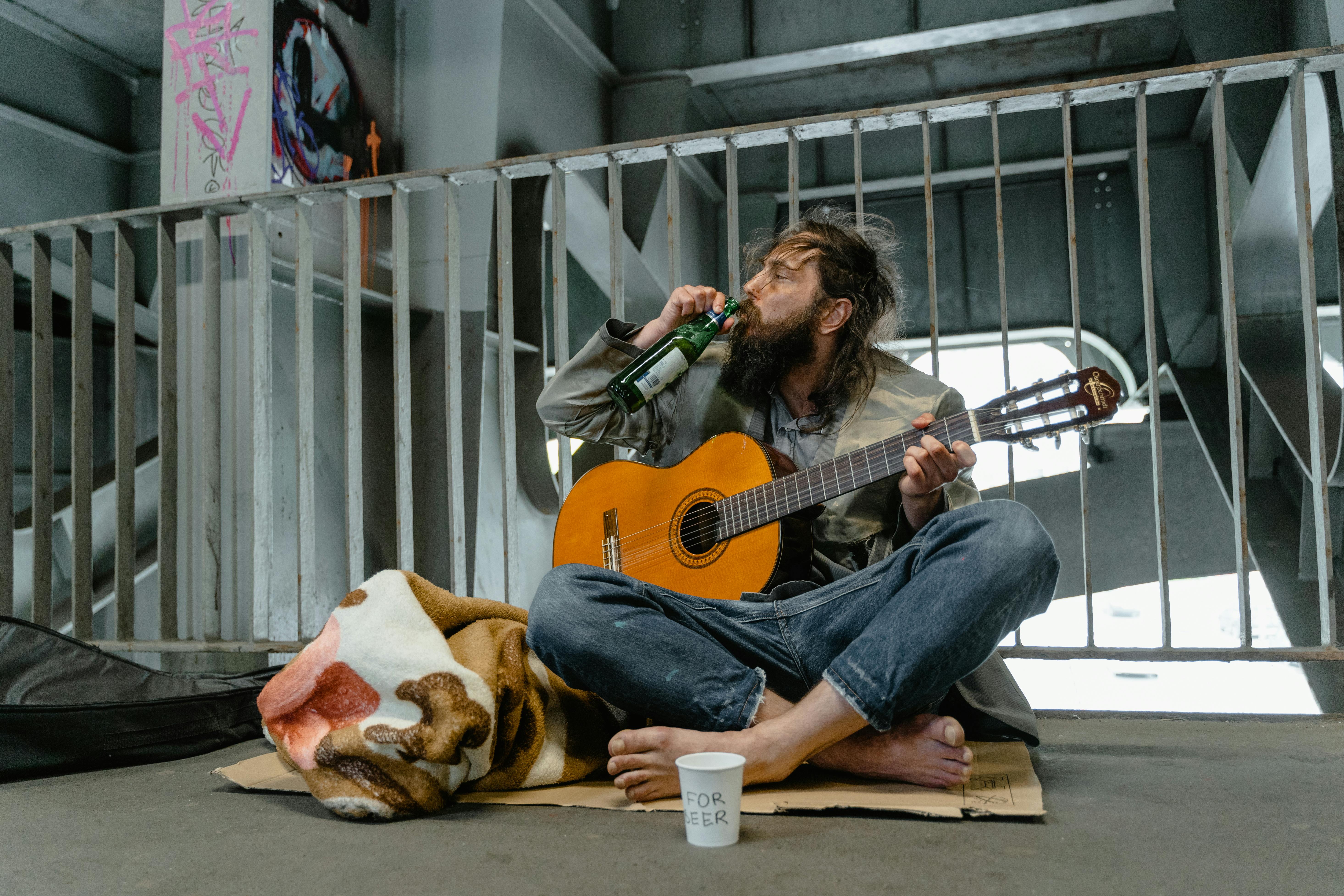 A Homeless Man Drinking · Free Stock Photo