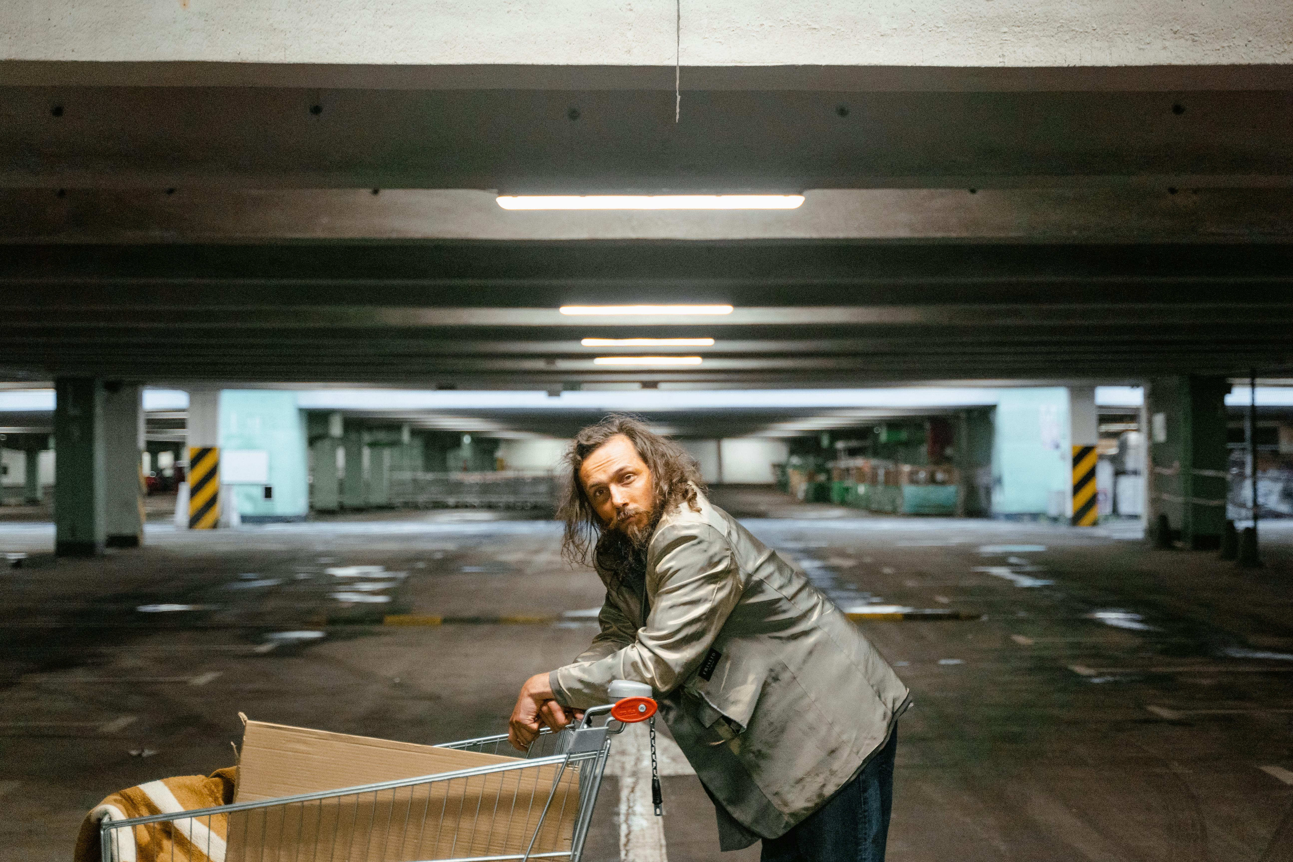 A Homeless Man at a Parking Lot · Free Stock Photo