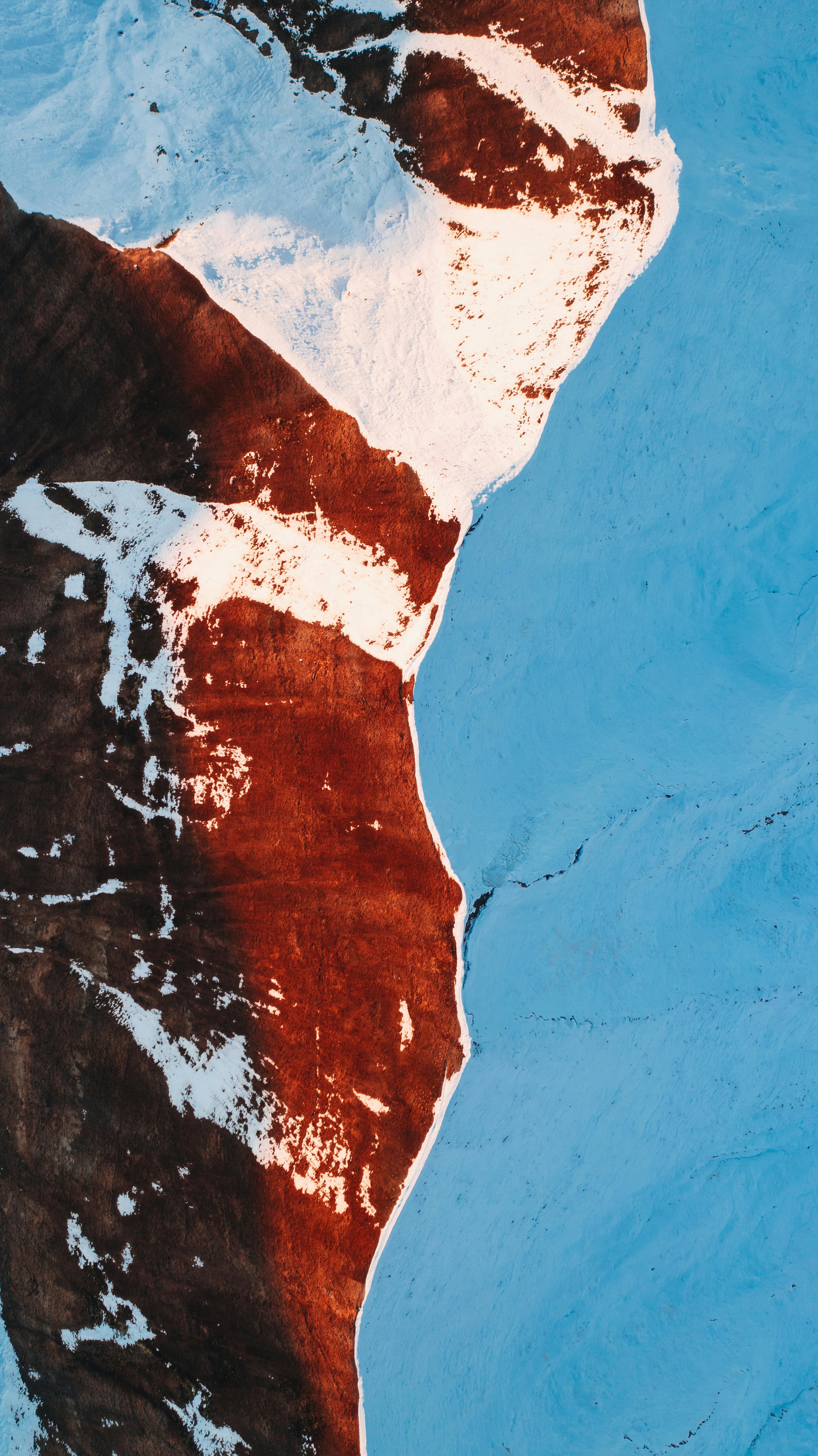 Rough frozen surface under old stone · Free Stock Photo