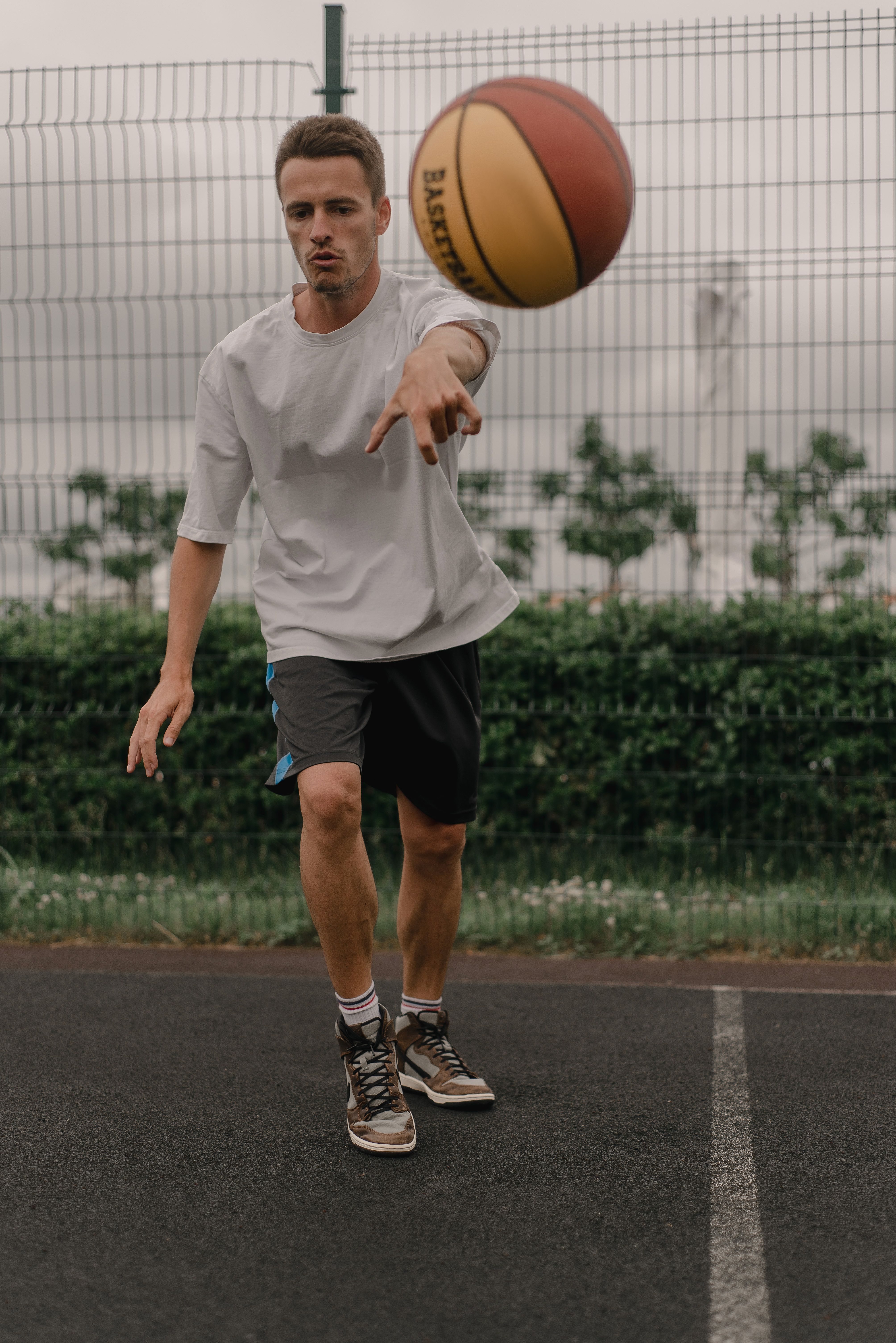 Man Throwing a Ball · Free Stock Photo