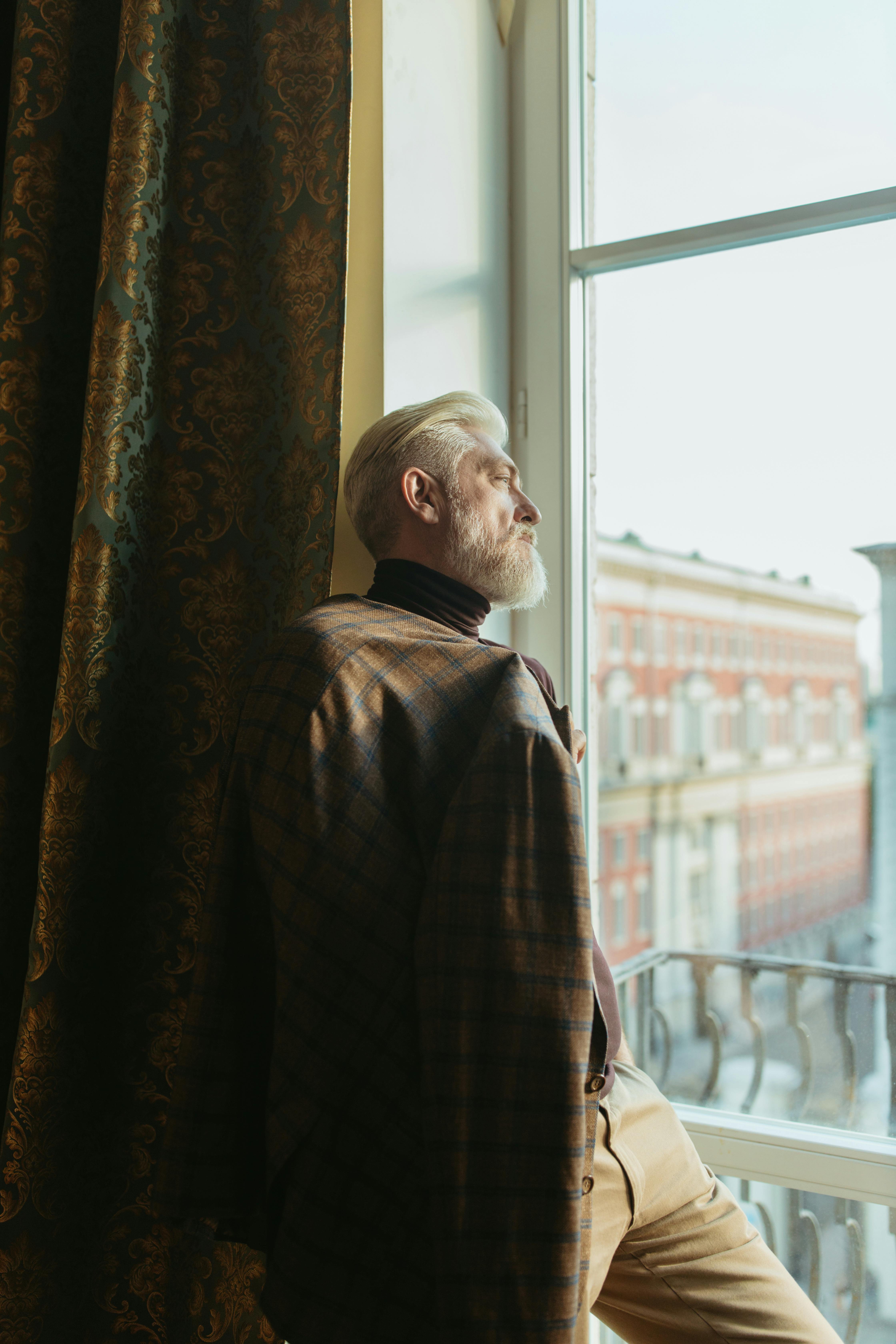 Man Sitting by the Window · Free Stock Photo