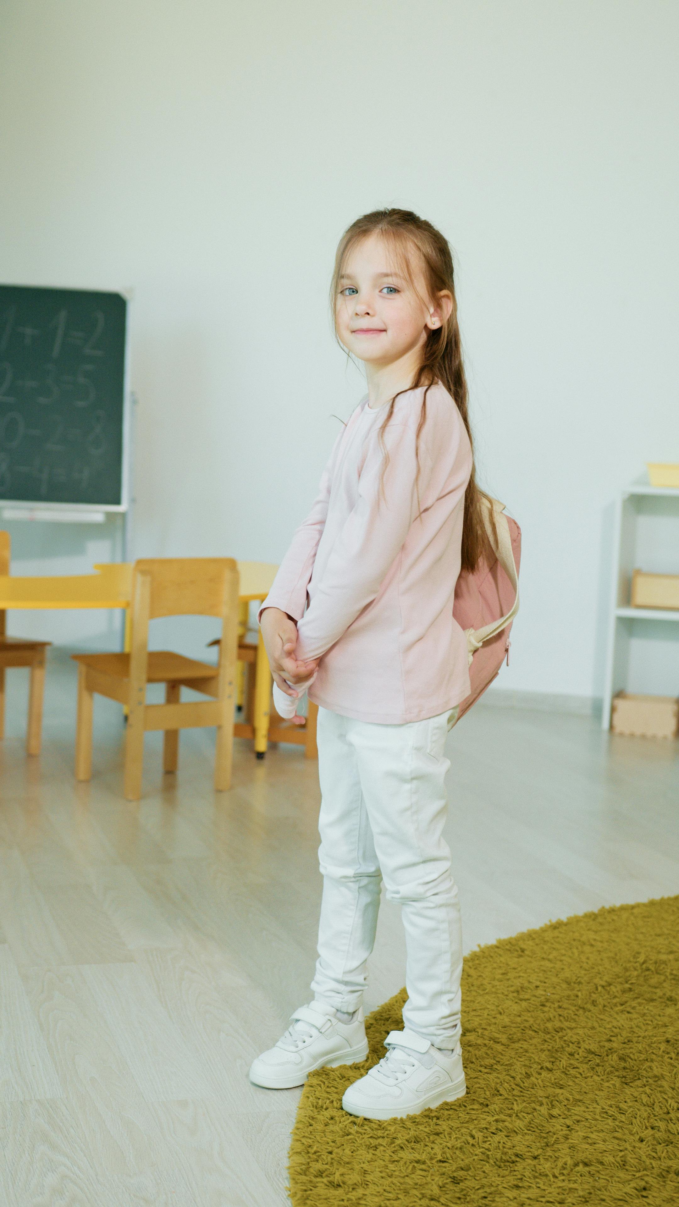 A Young Girl Carrying her Backpack · Free Stock Photo