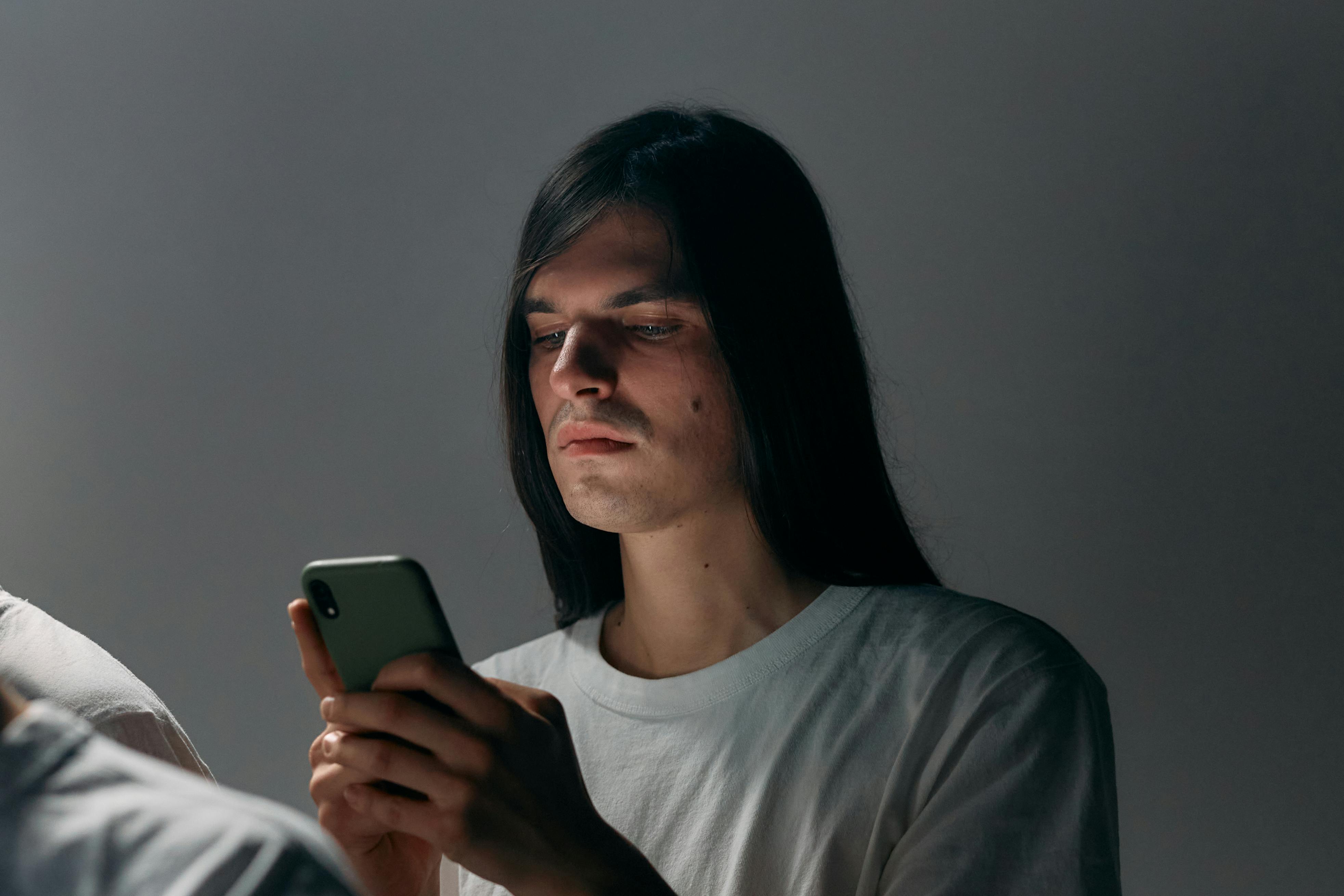 Photo of Man Engaged in his Smartphone · Free Stock Photo